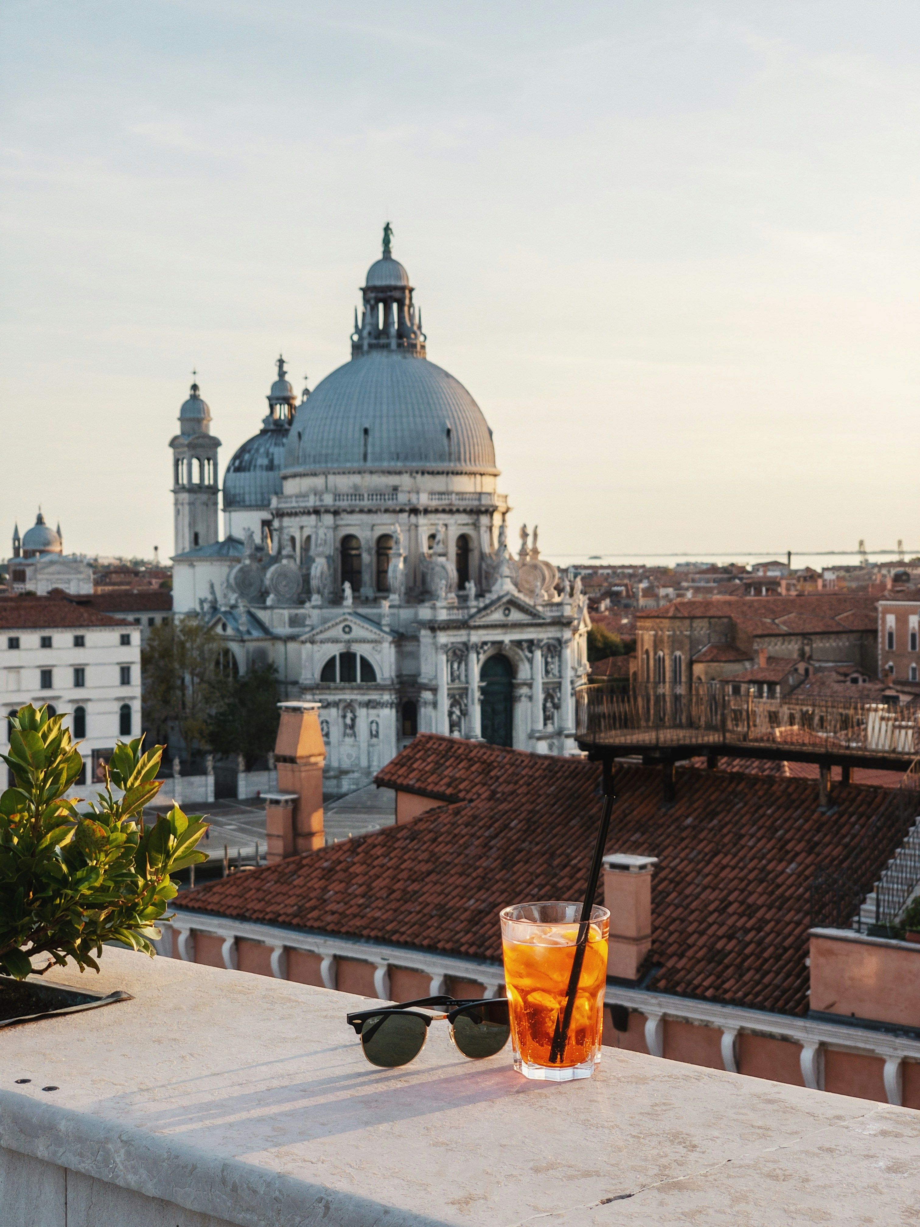Scenic Venice Rooftop View with Basilica at Sunset · Free Stock Photo