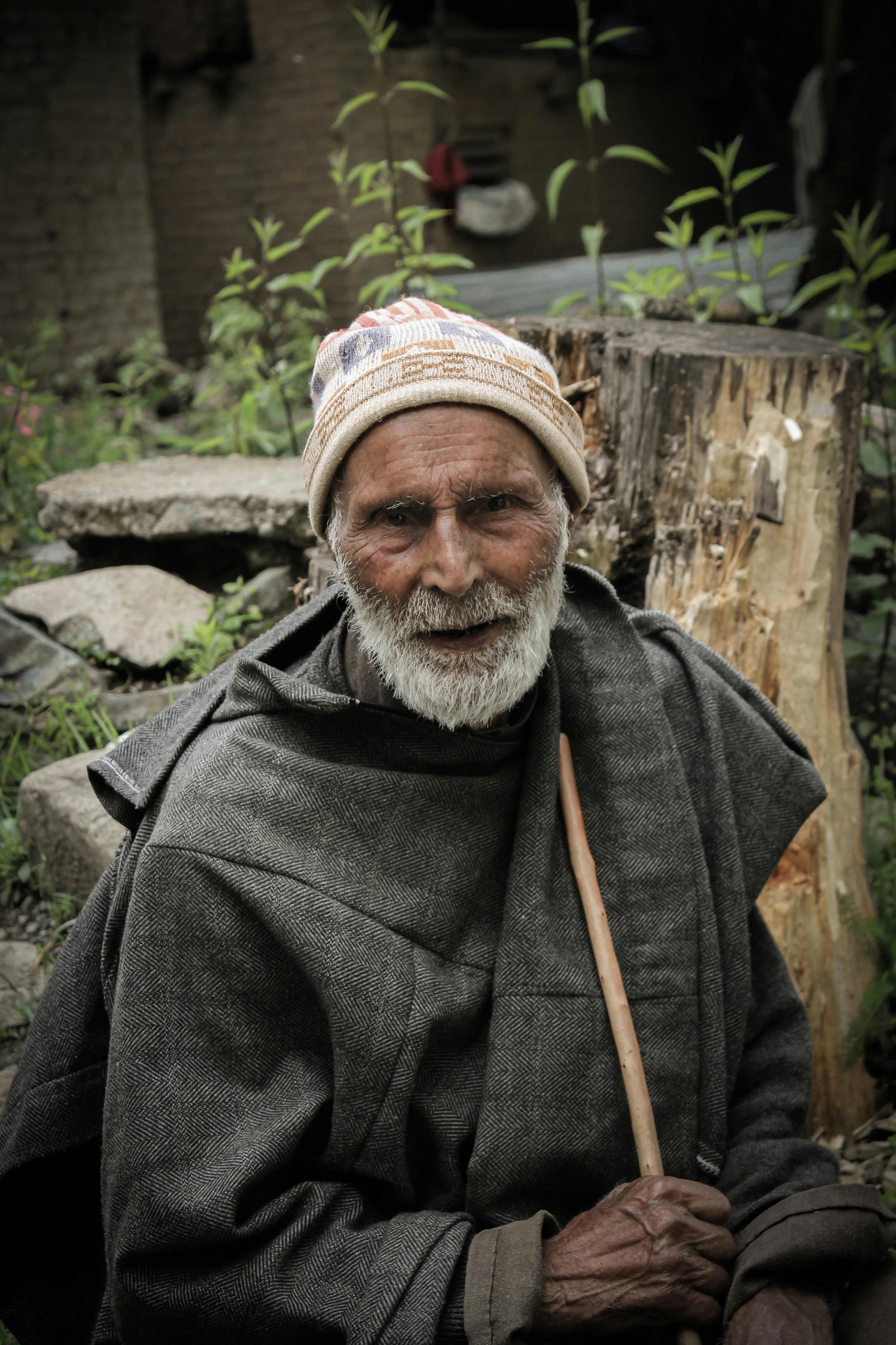 Elderly Man in Outdoor Rural Setting · Free Stock Photo