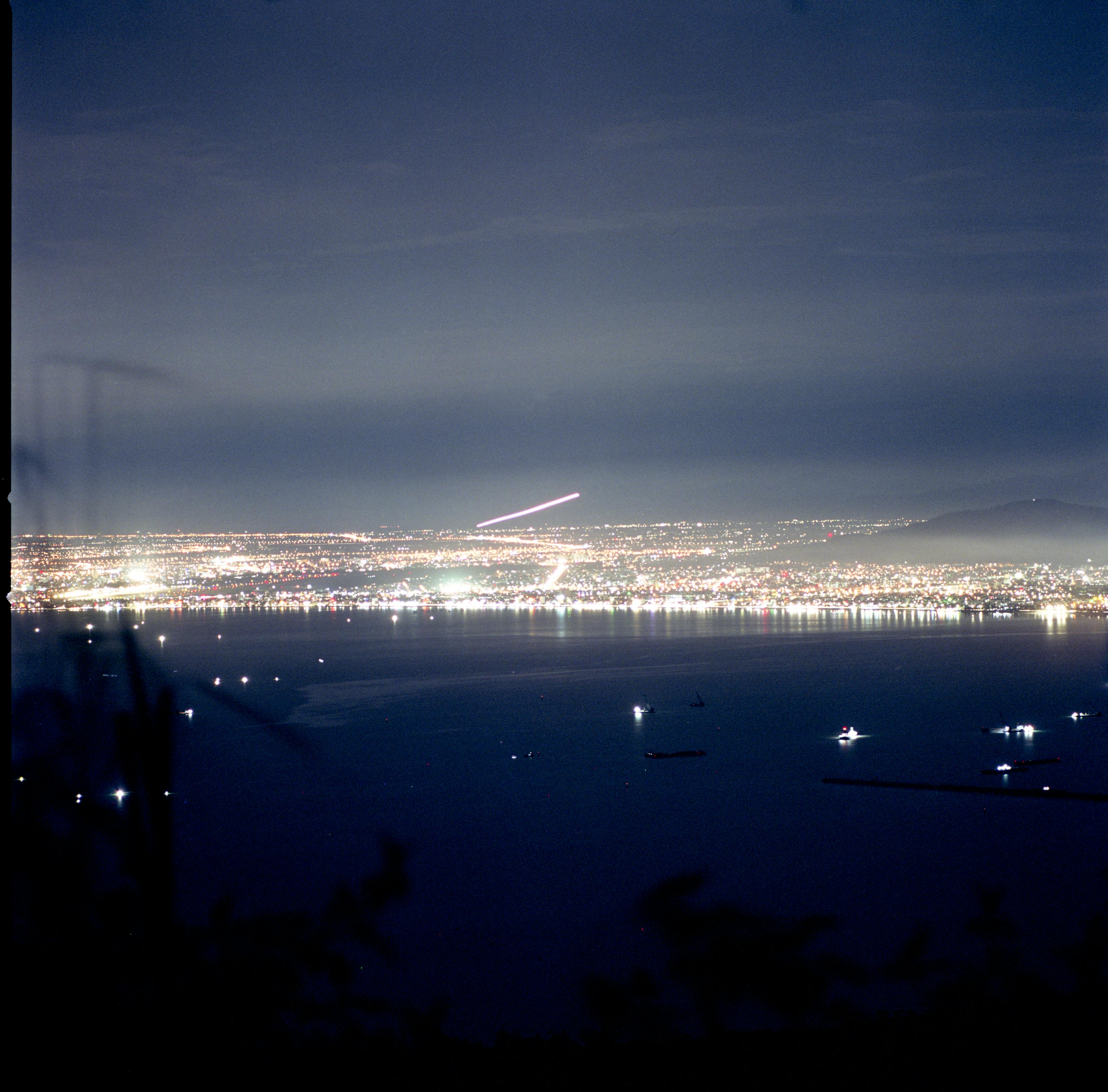 Stunning Aerial Night View of Coastal Cityscape · Free Stock Photo
