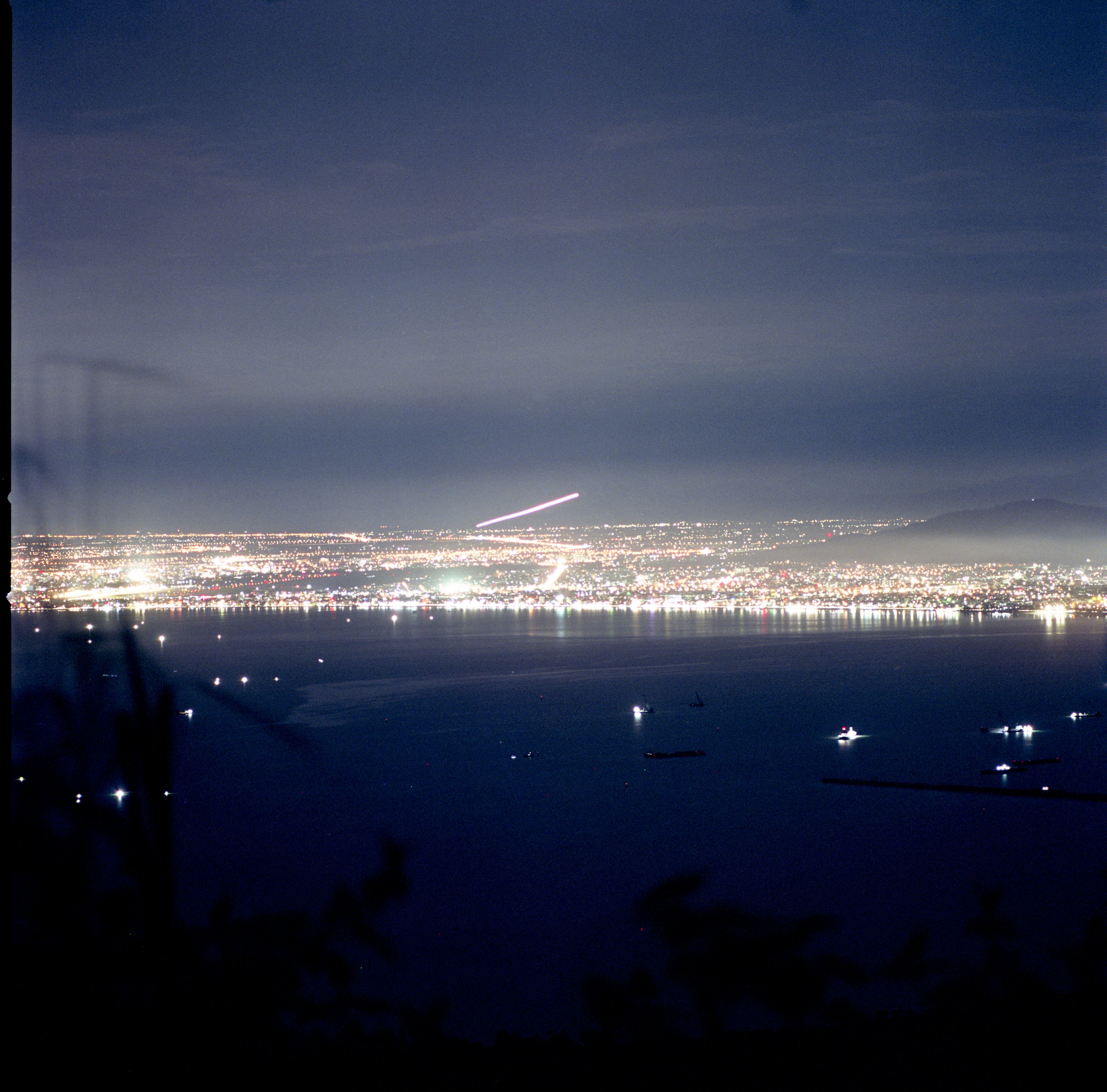 Stunning Aerial Night View of Coastal Cityscape · Free Stock Photo