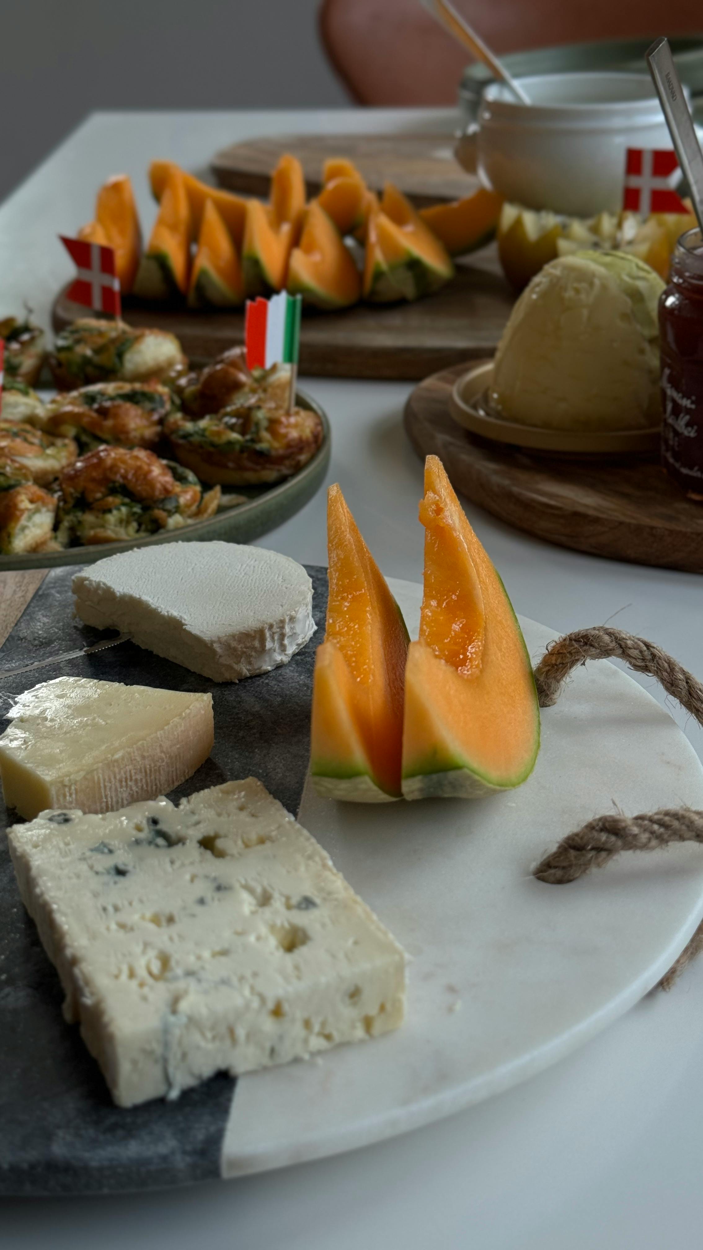 Elegant European Cheese and Melon Platter · Free Stock Photo