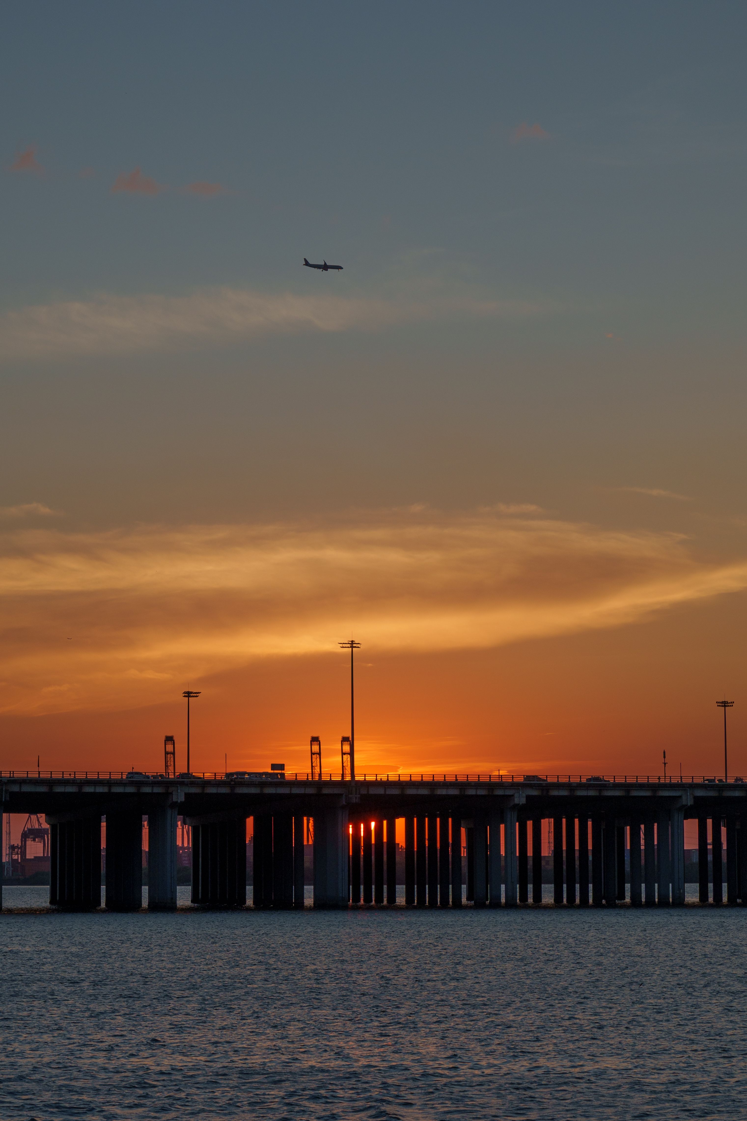 Aerial Plane Over Bridge at Sunset · Free Stock Photo