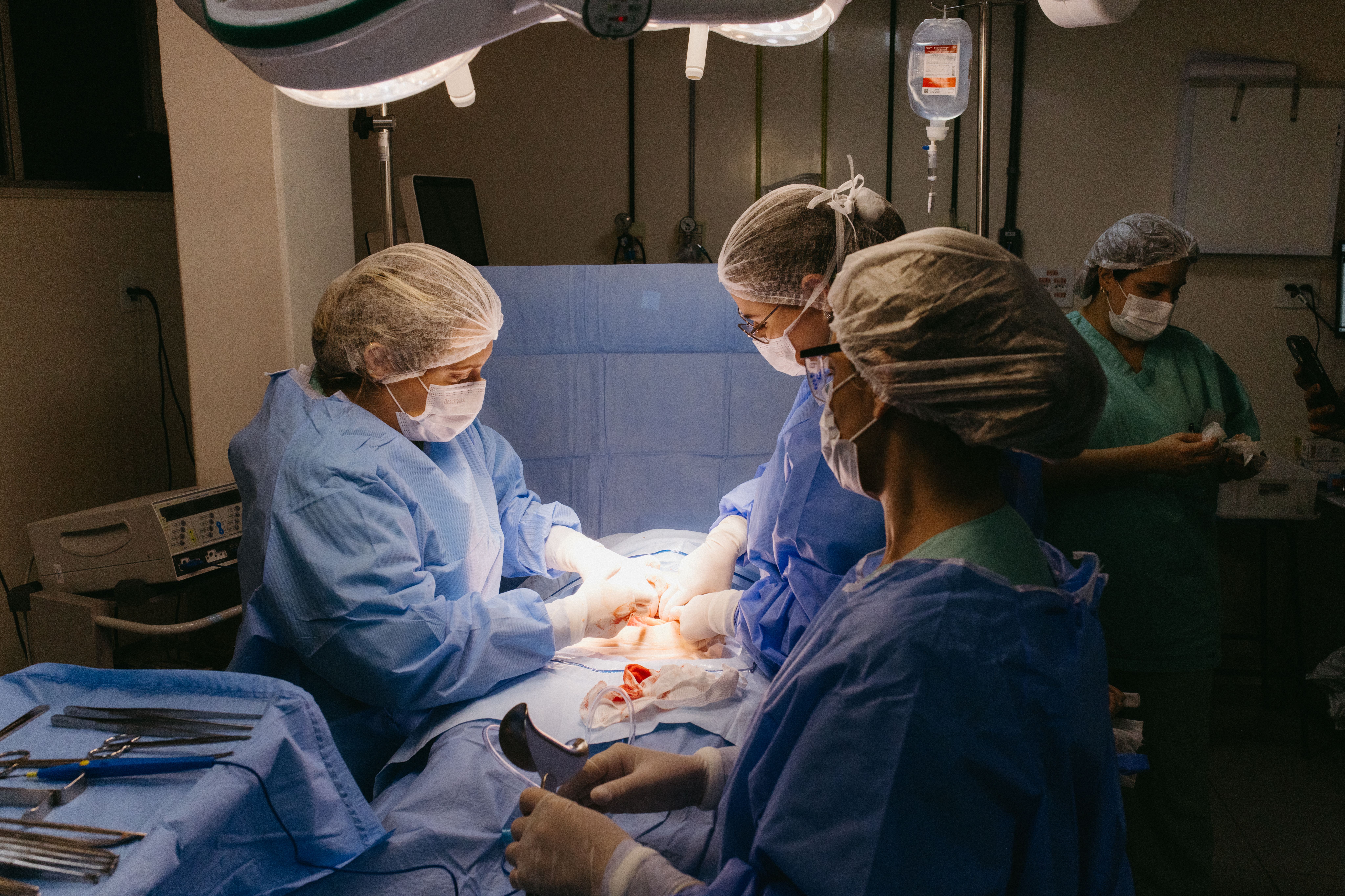 Surgeons in Operating Room Performing Surgery · Free Stock Photo