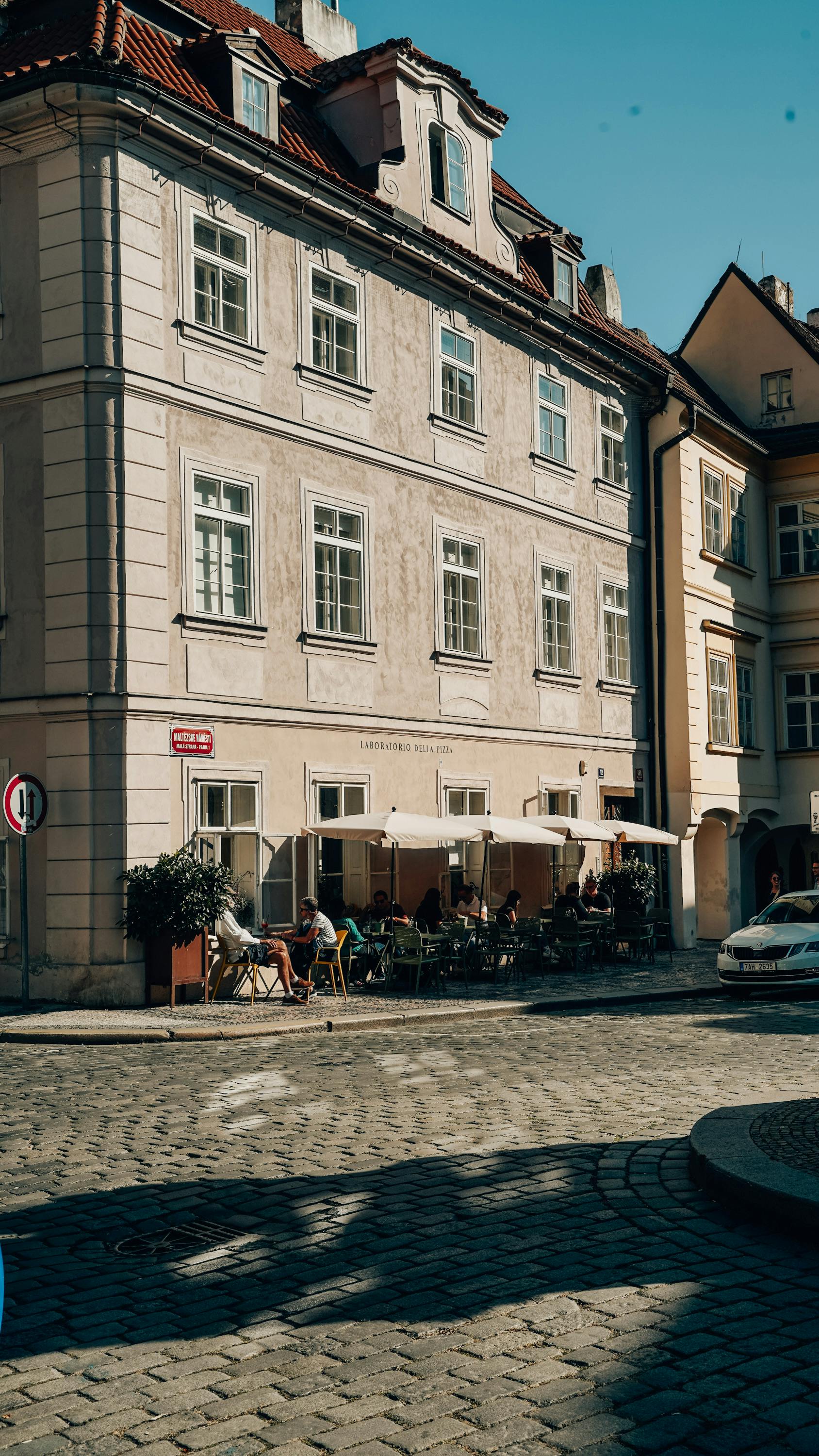 Charming European Outdoor Cafe Street View · Free Stock Photo