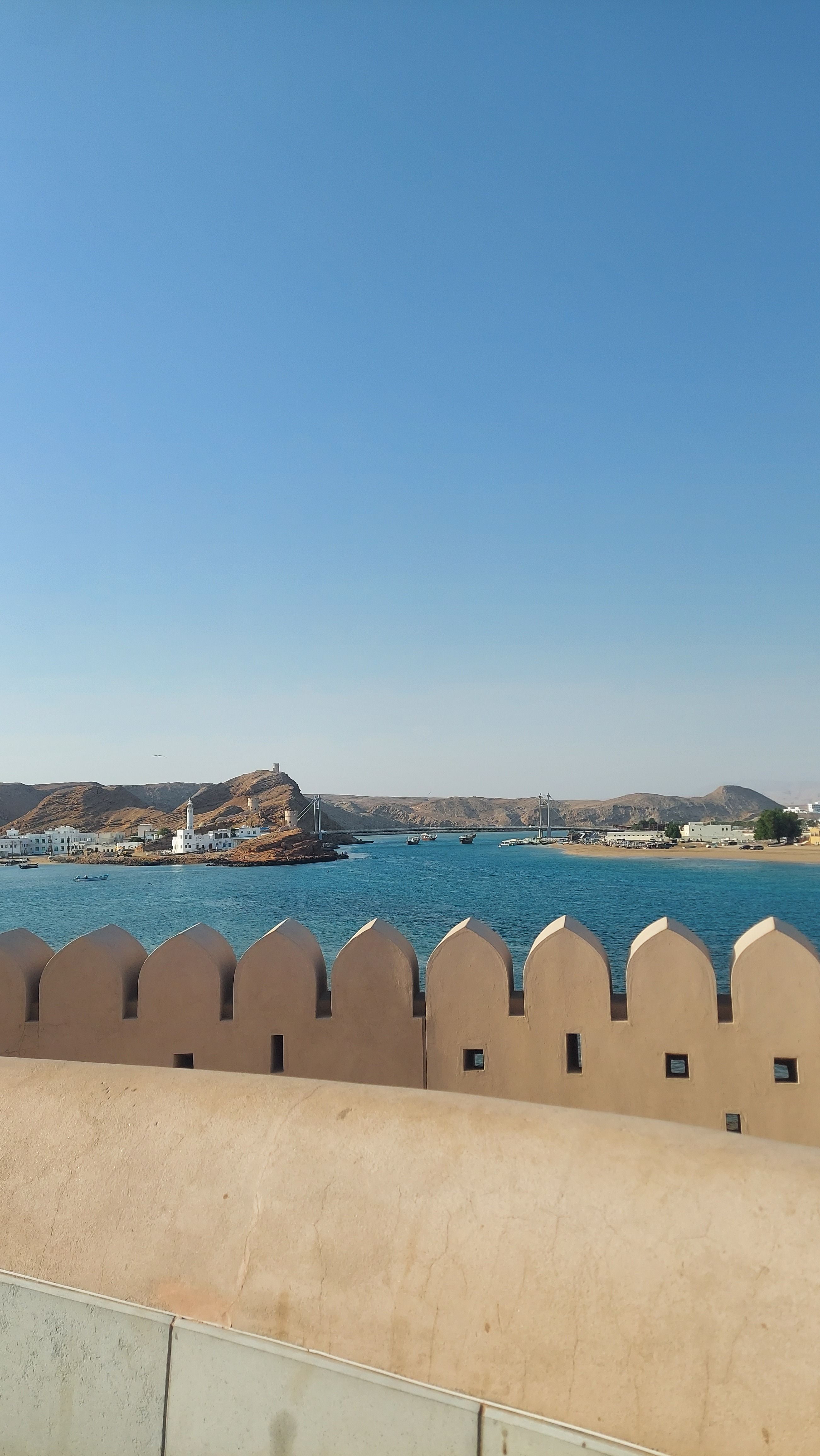 Stunning Coastal View with Fort Wall in Oman · Free Stock Photo