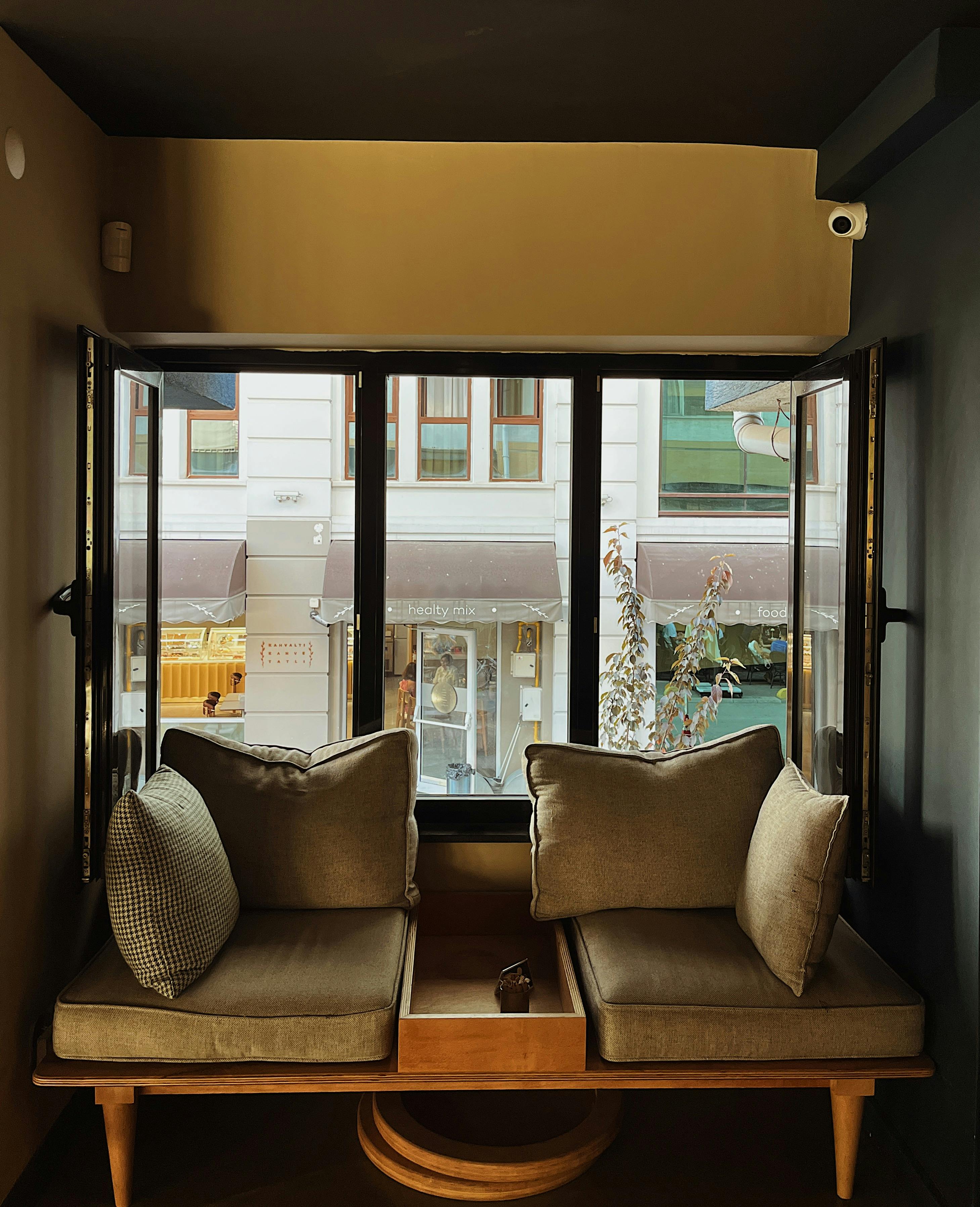 Cozy Cafe Window Seat with Street View · Free Stock Photo