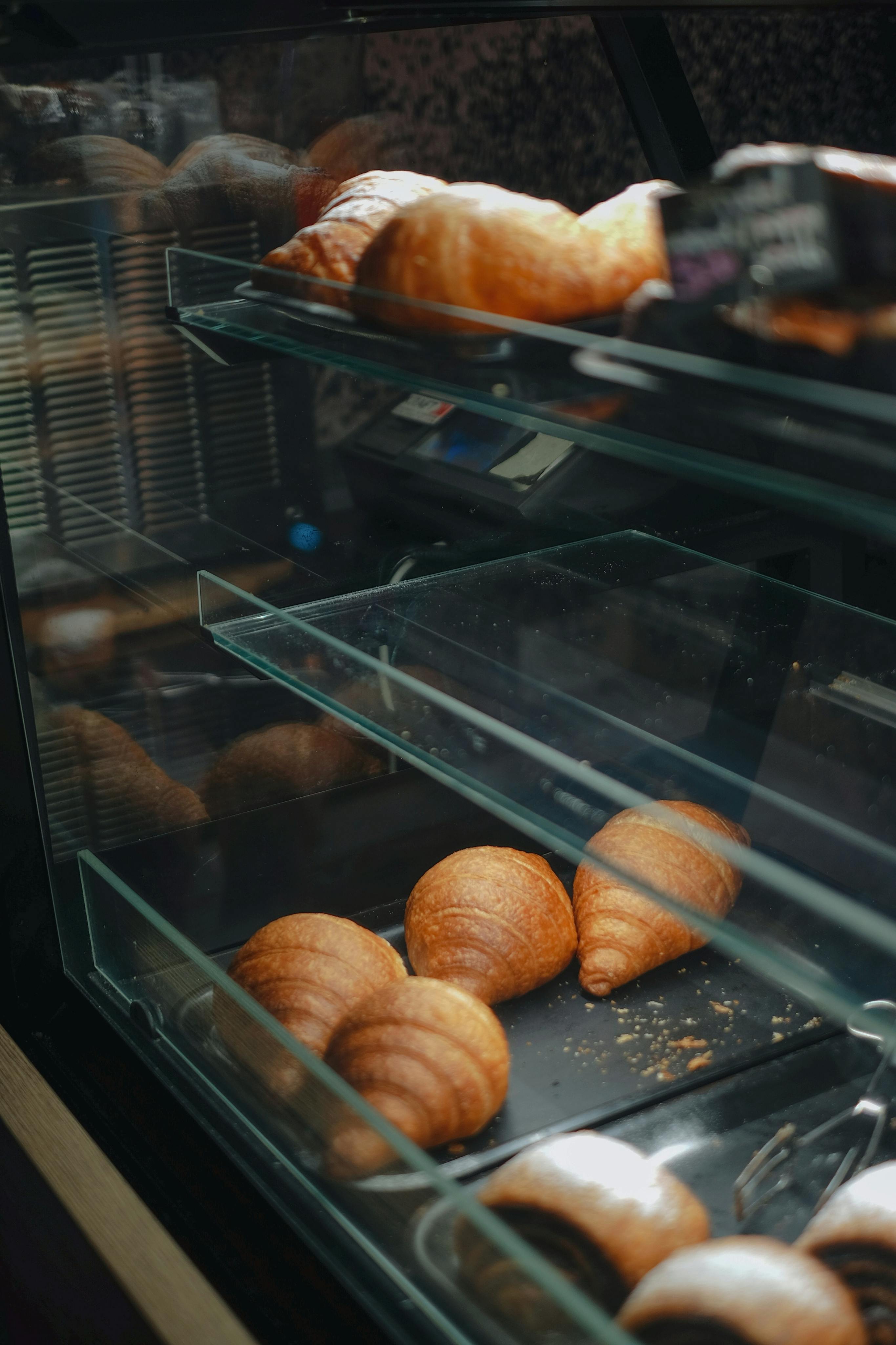 Fresh Croissants in a Bakery Display Case · Free Stock Photo