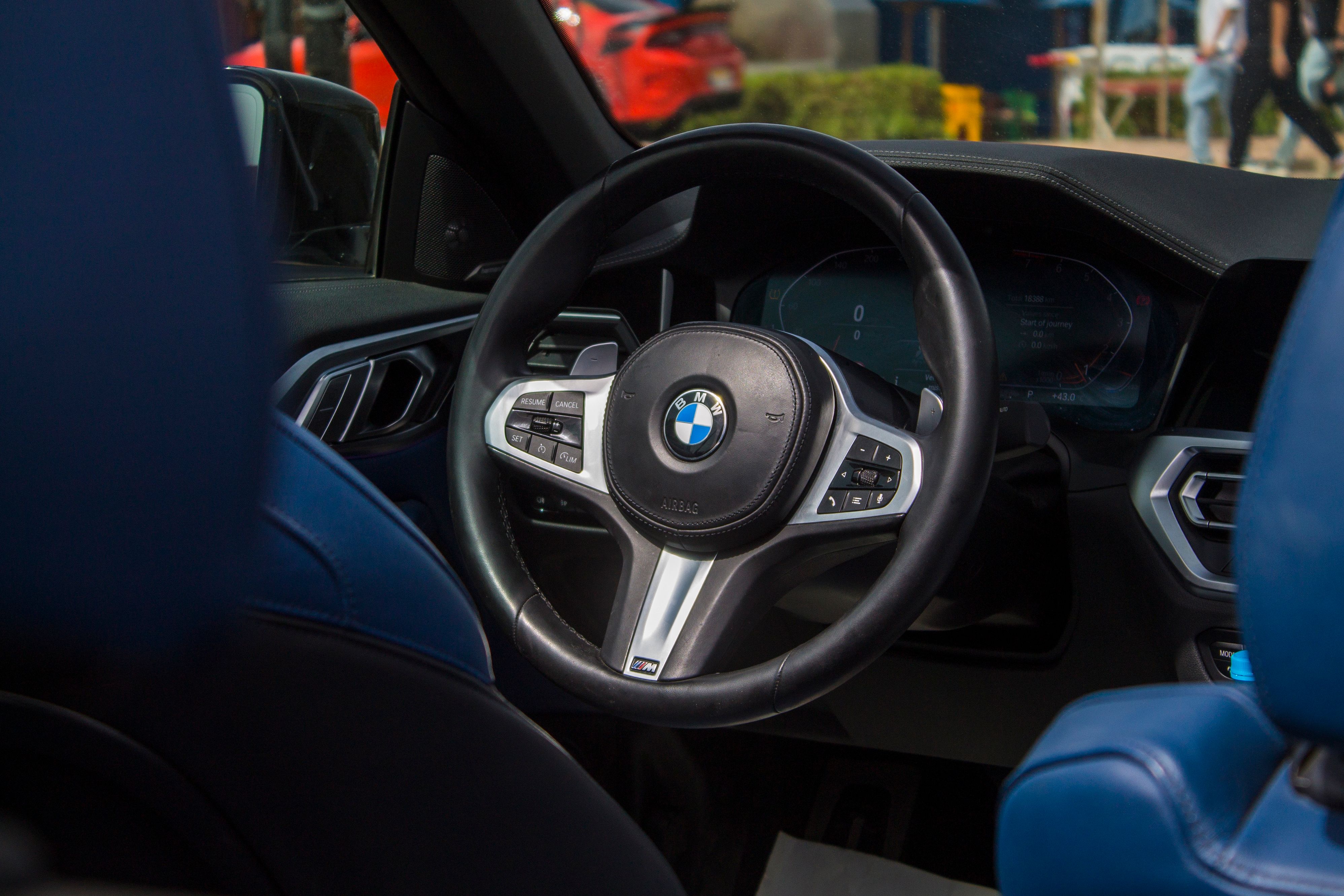 Luxury Car Interior with Steering Wheel Focus · Free Stock Photo