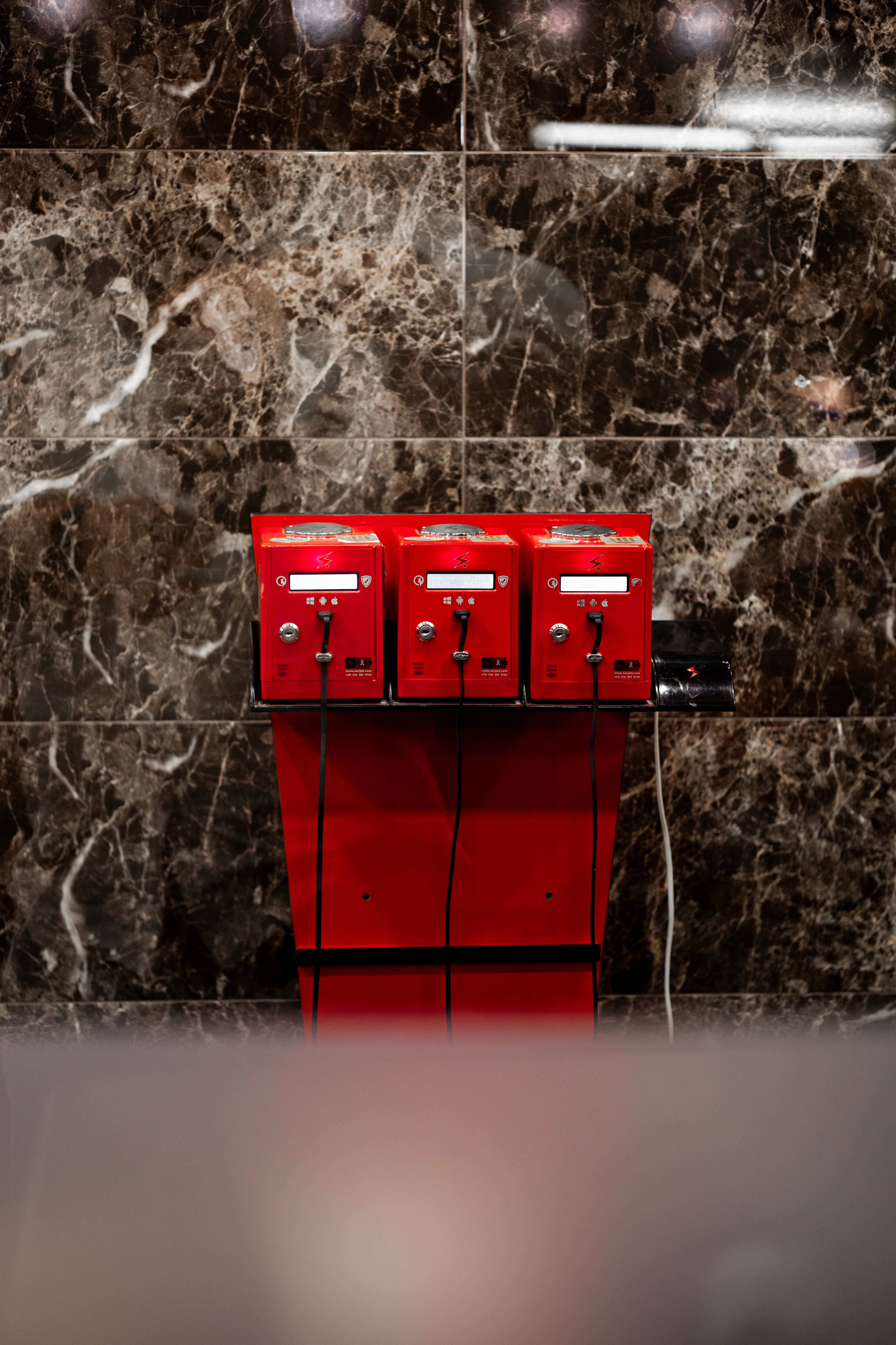 Red Public Payphones on Marble Wall in Yalova · Free Stock Photo