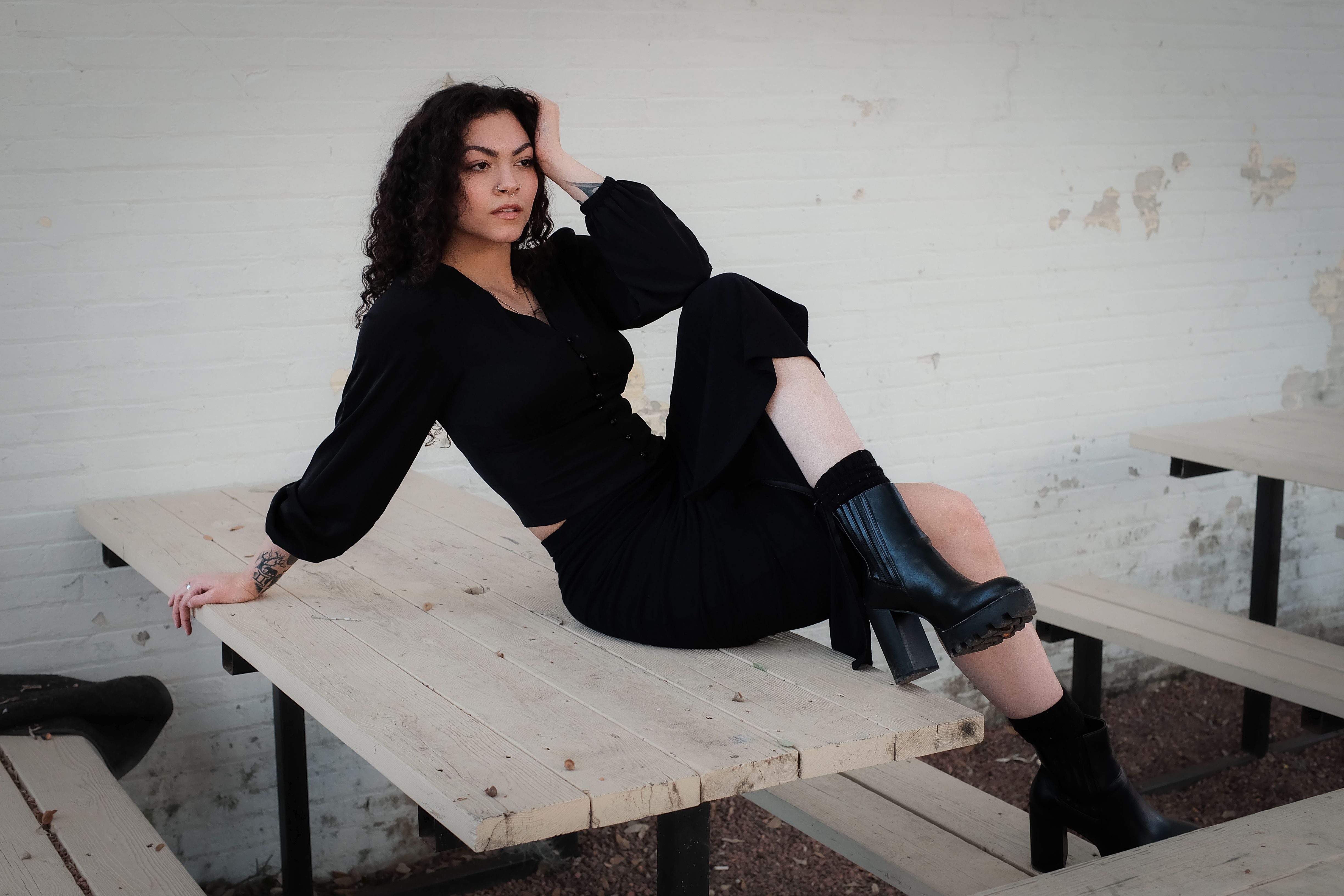 Stylish Woman Posing on Outdoor Wooden Bench · Free Stock Photo