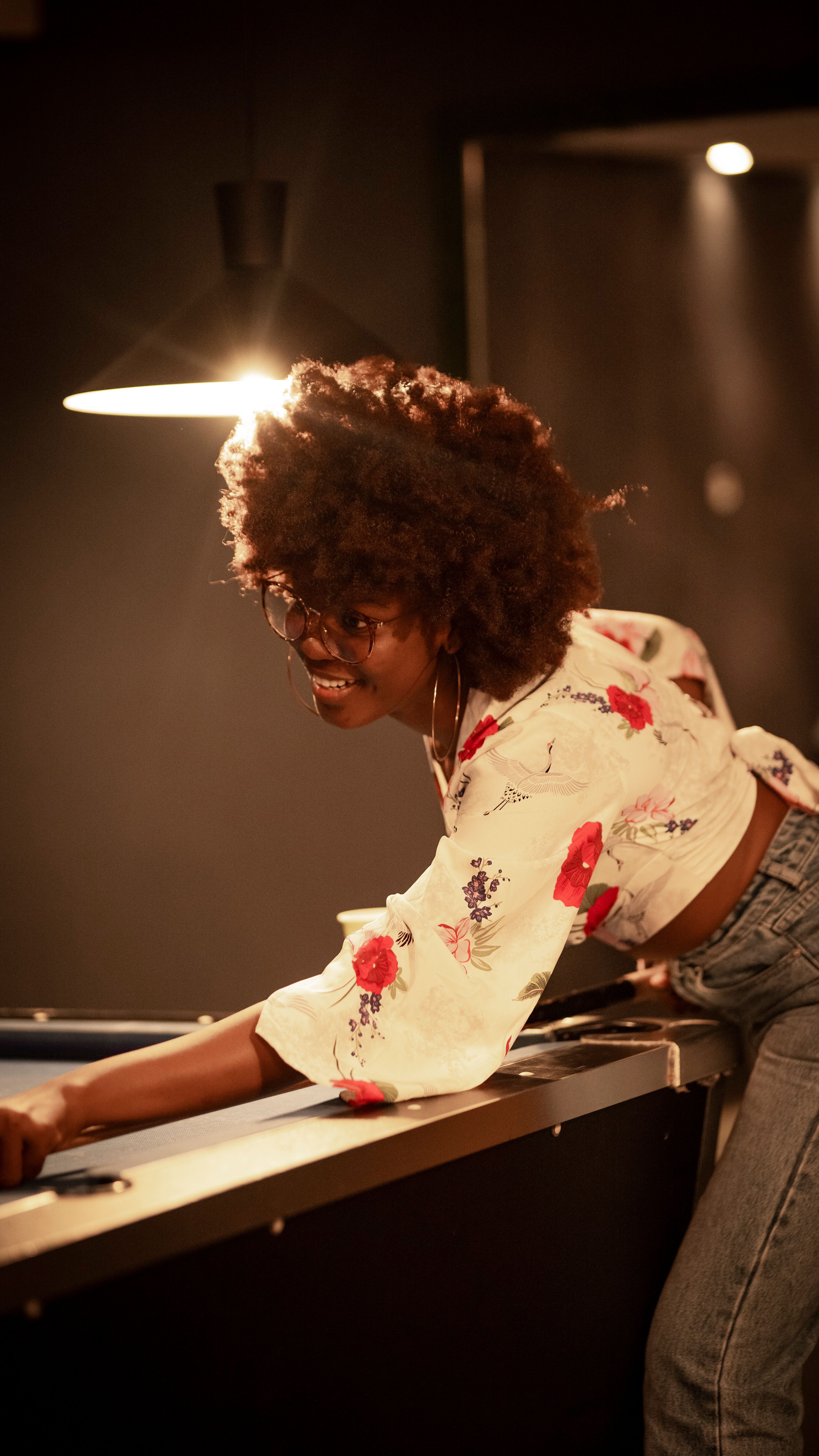 Young Woman Playing Pool Indoors · Free Stock Photo