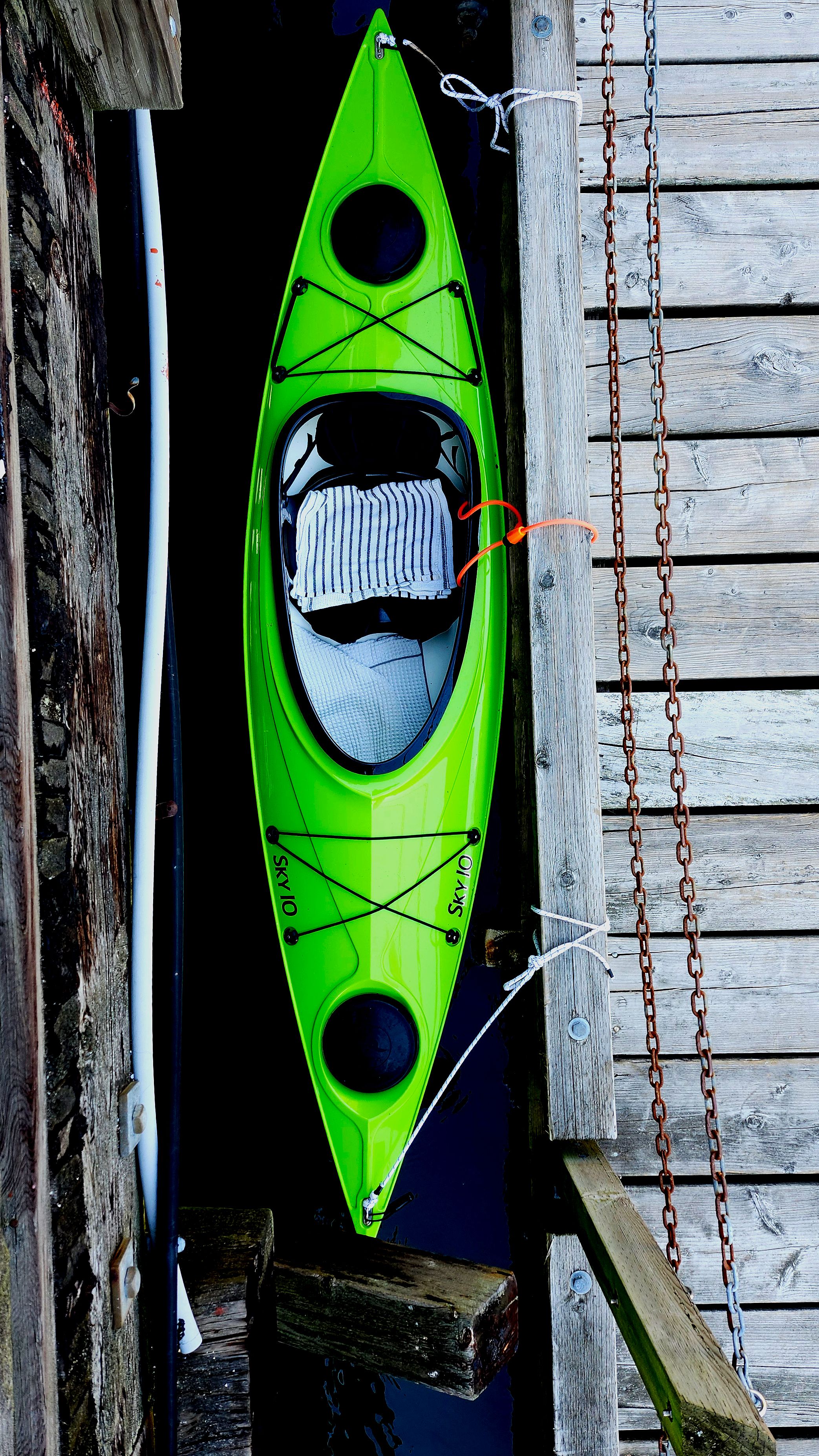 Bright Green Kayak Docked on Wooden Pier · Free Stock Photo