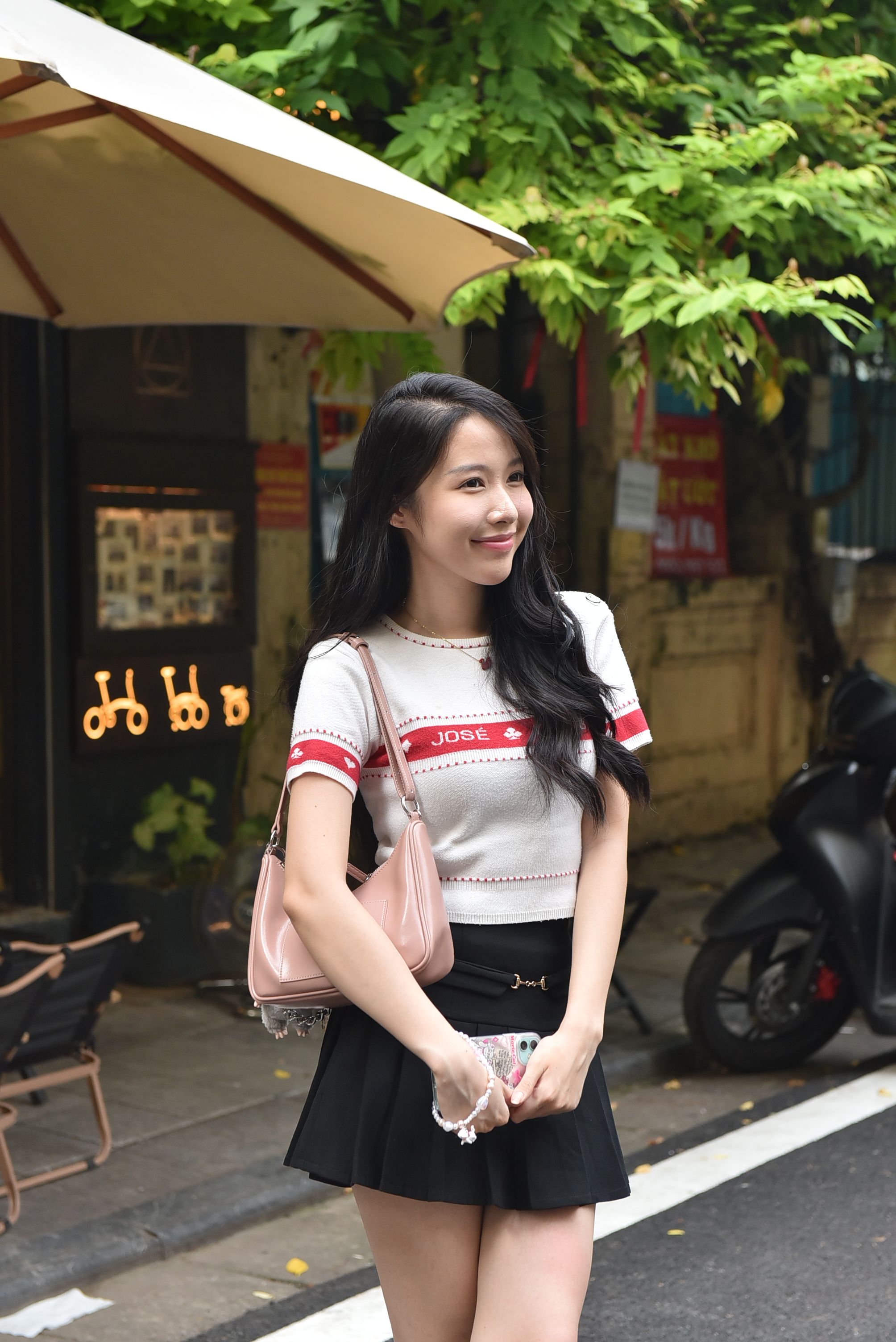 Woman in Summer Outfit on City Street · Free Stock Photo