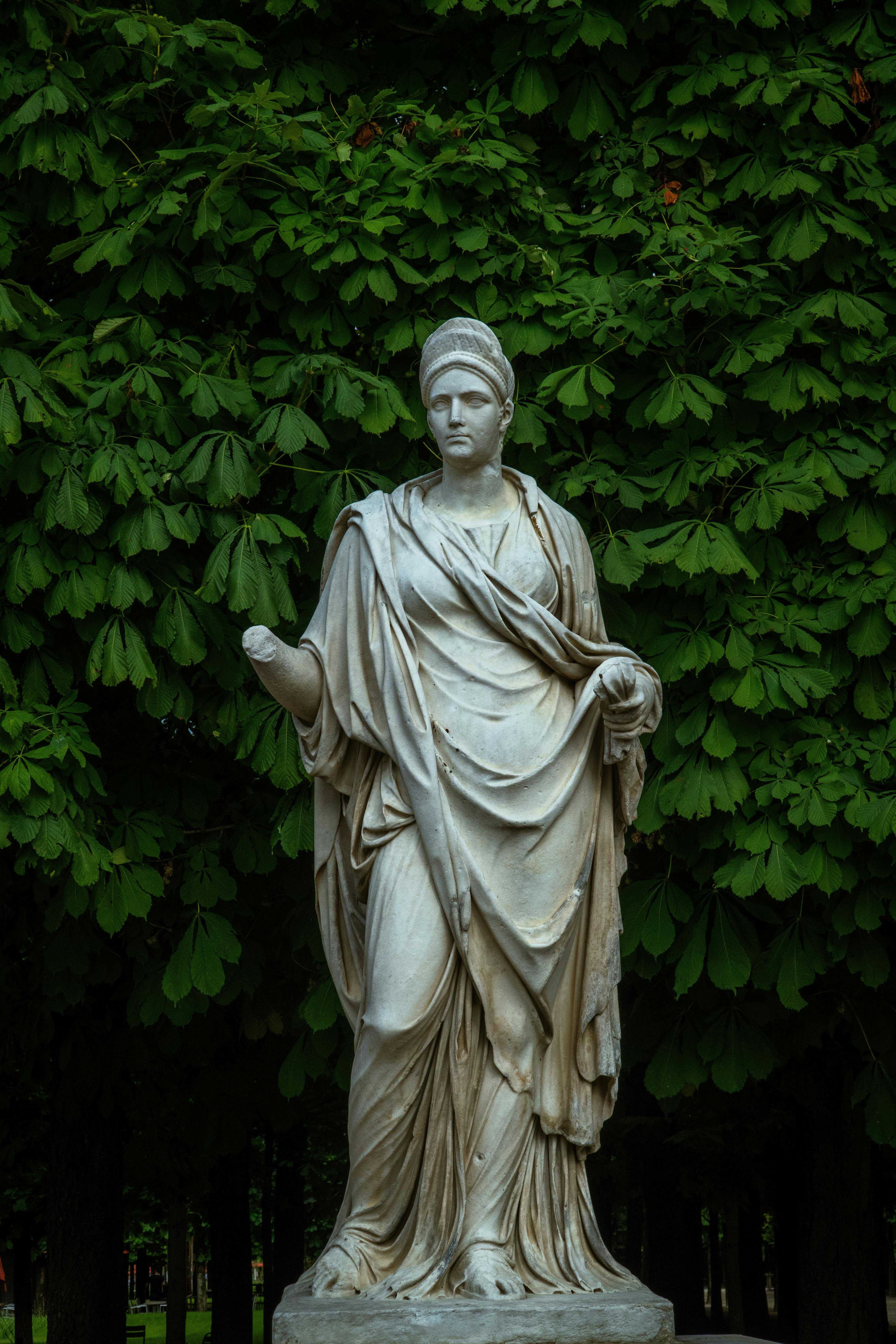 Classical Marble Statue in Lush Garden · Free Stock Photo