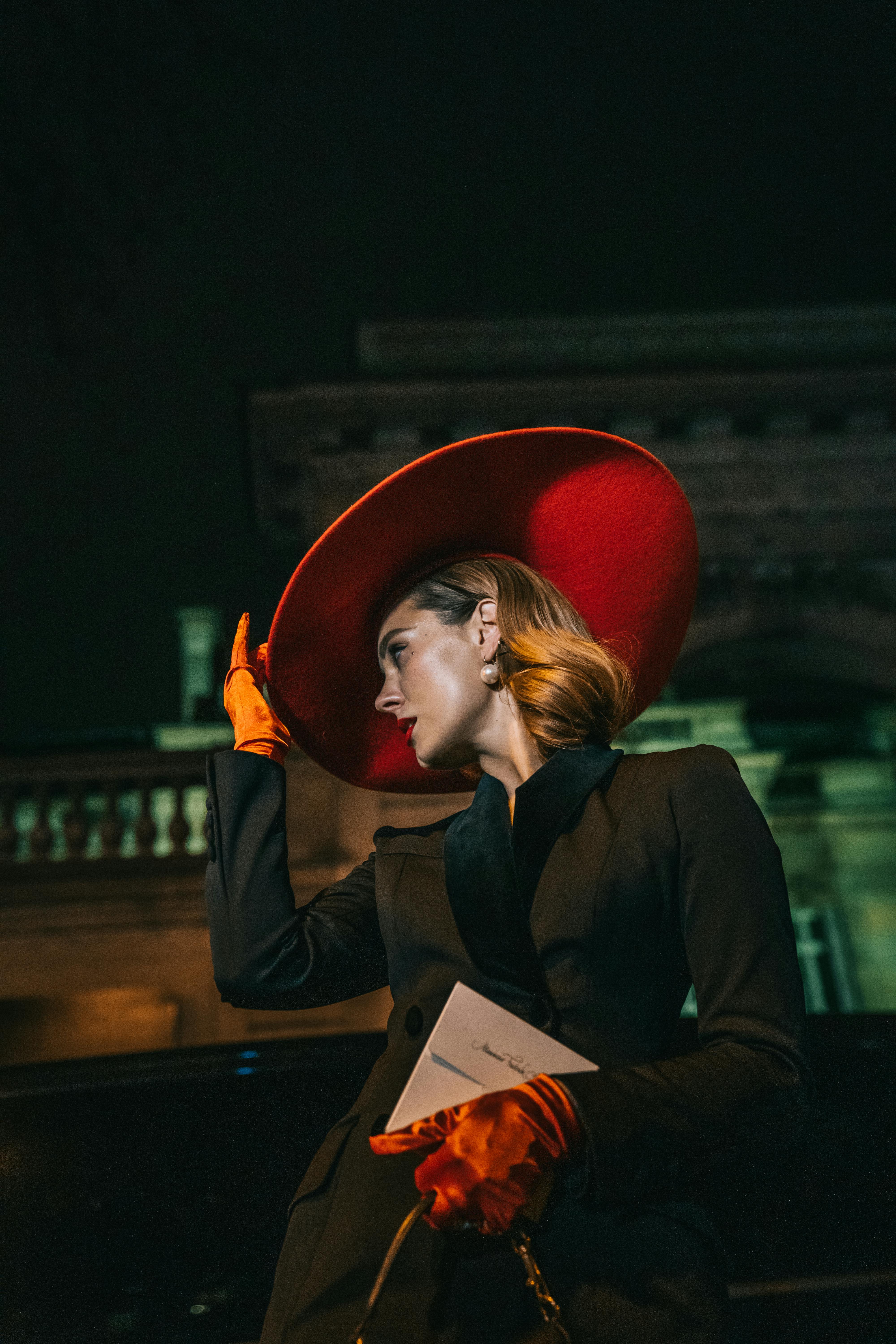 Elegant Woman in Red Hat at Night in Paris · Free Stock Photo