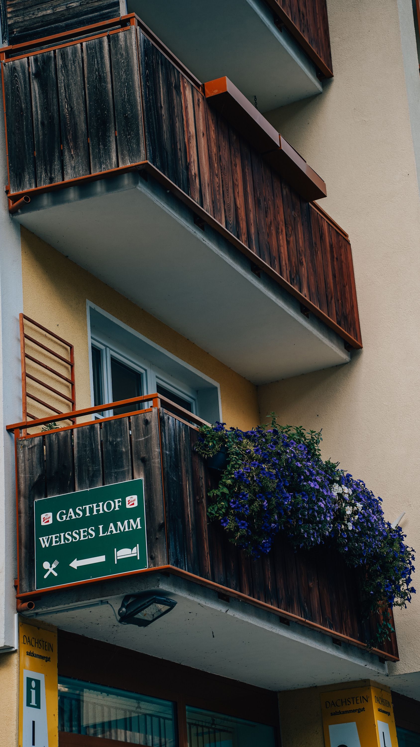 Rustic Balcony with Sign and Flowers · Free Stock Photo