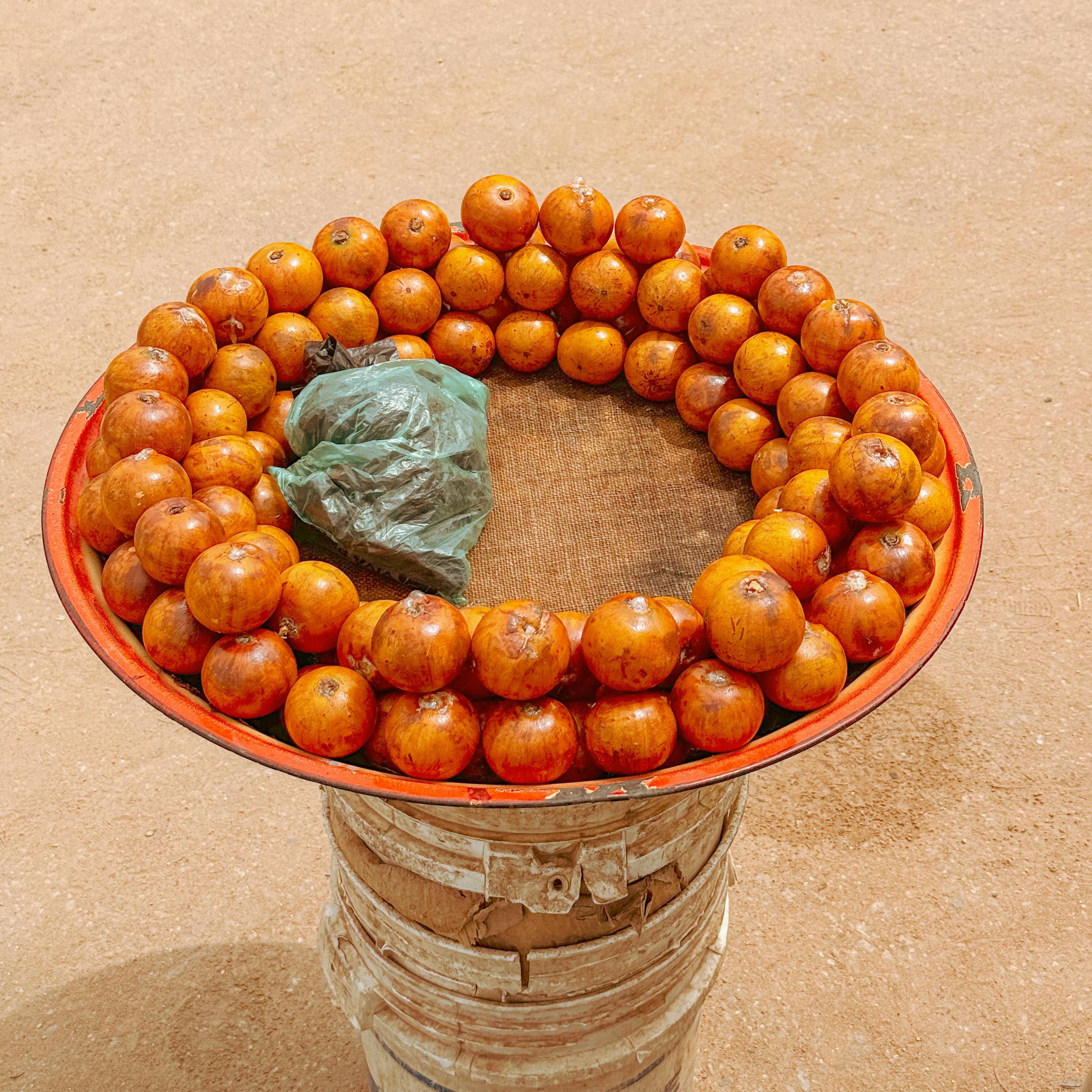 African Agbalumo Fruit Display in Abuja Market · Free Stock Photo