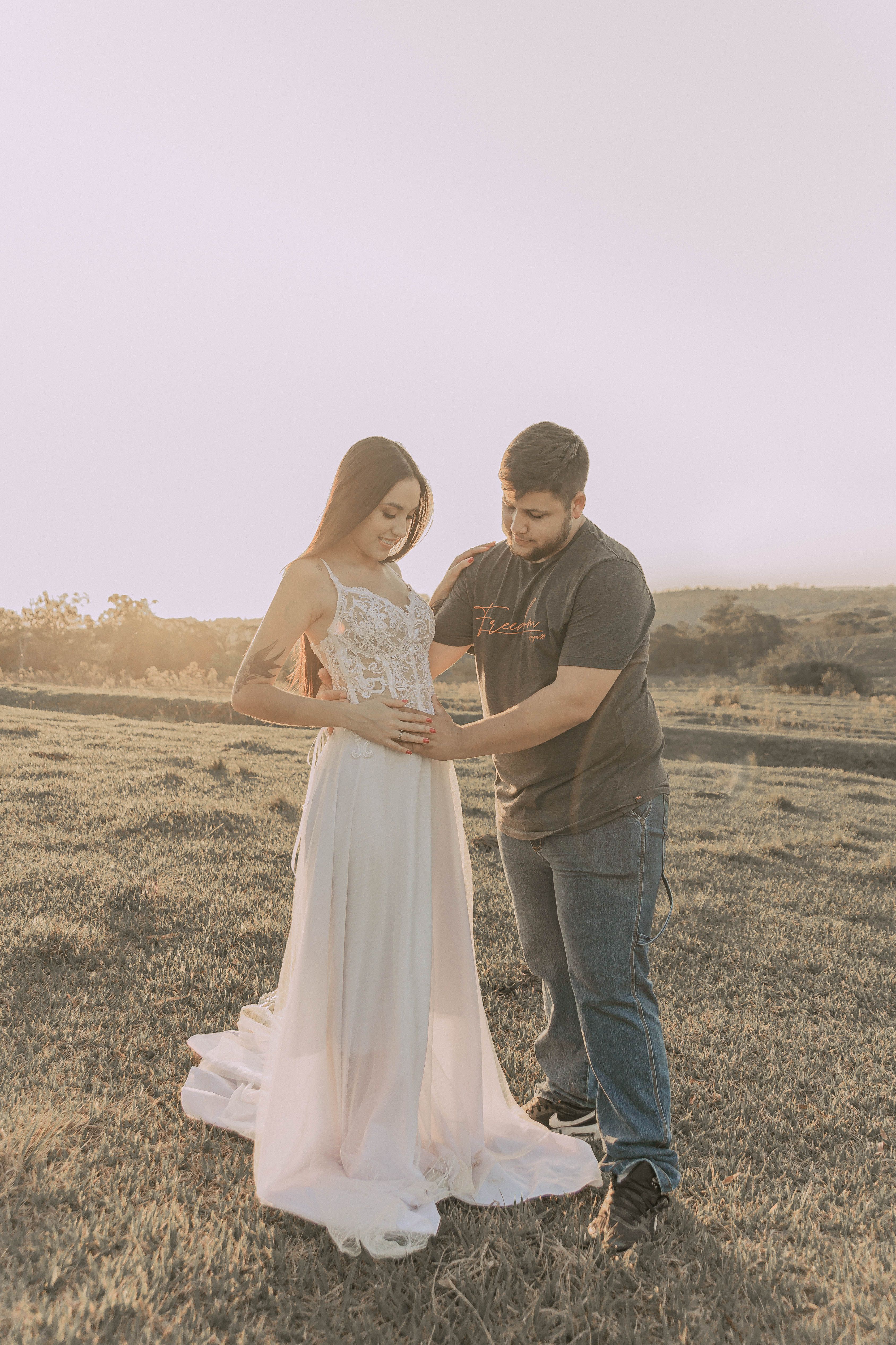 Romantic Outdoor Maternity Photo Session at Sunset · Free Stock Photo