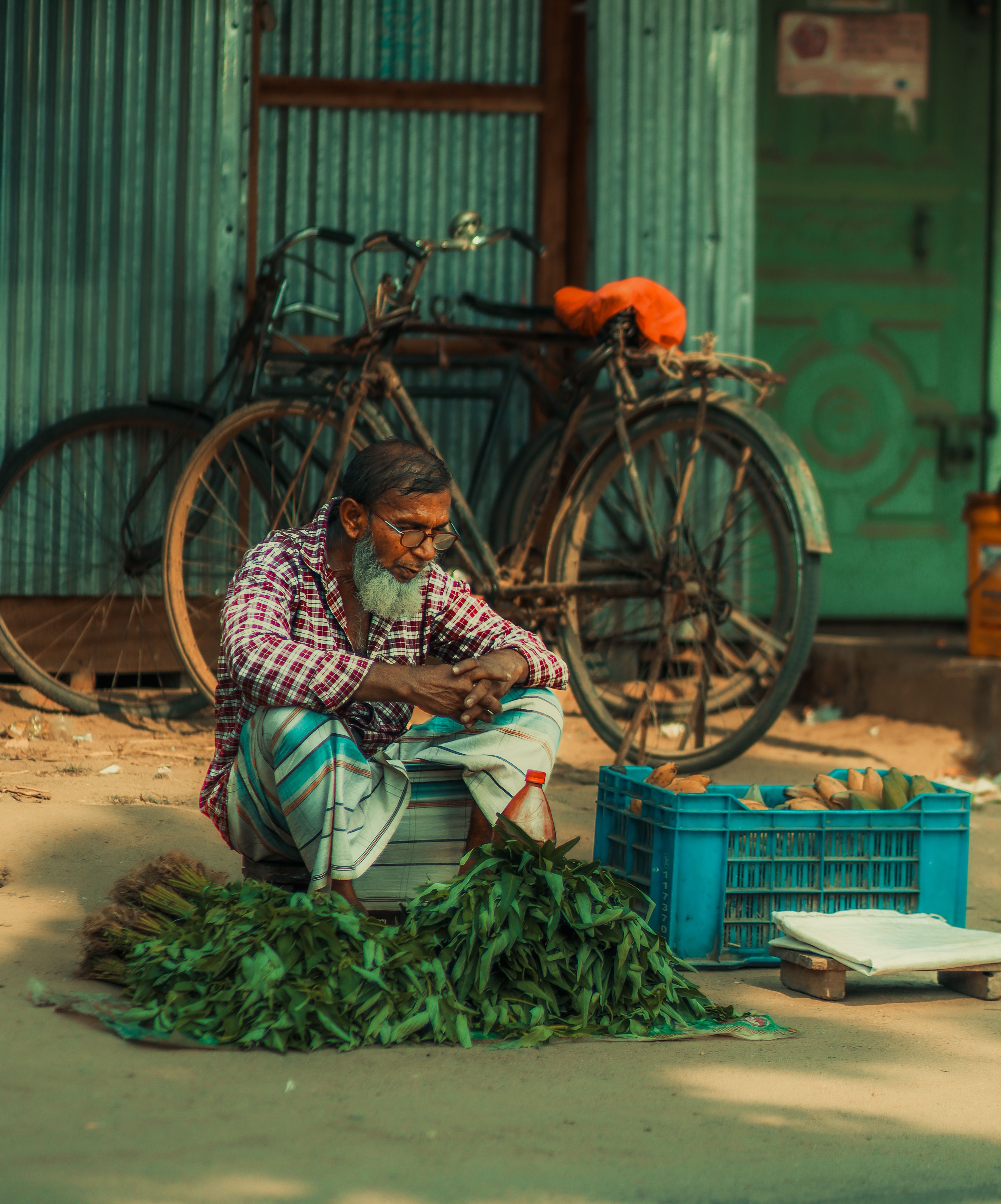 Elderly Vendor Selling Vegetables on Street Corner · Free Stock Photo