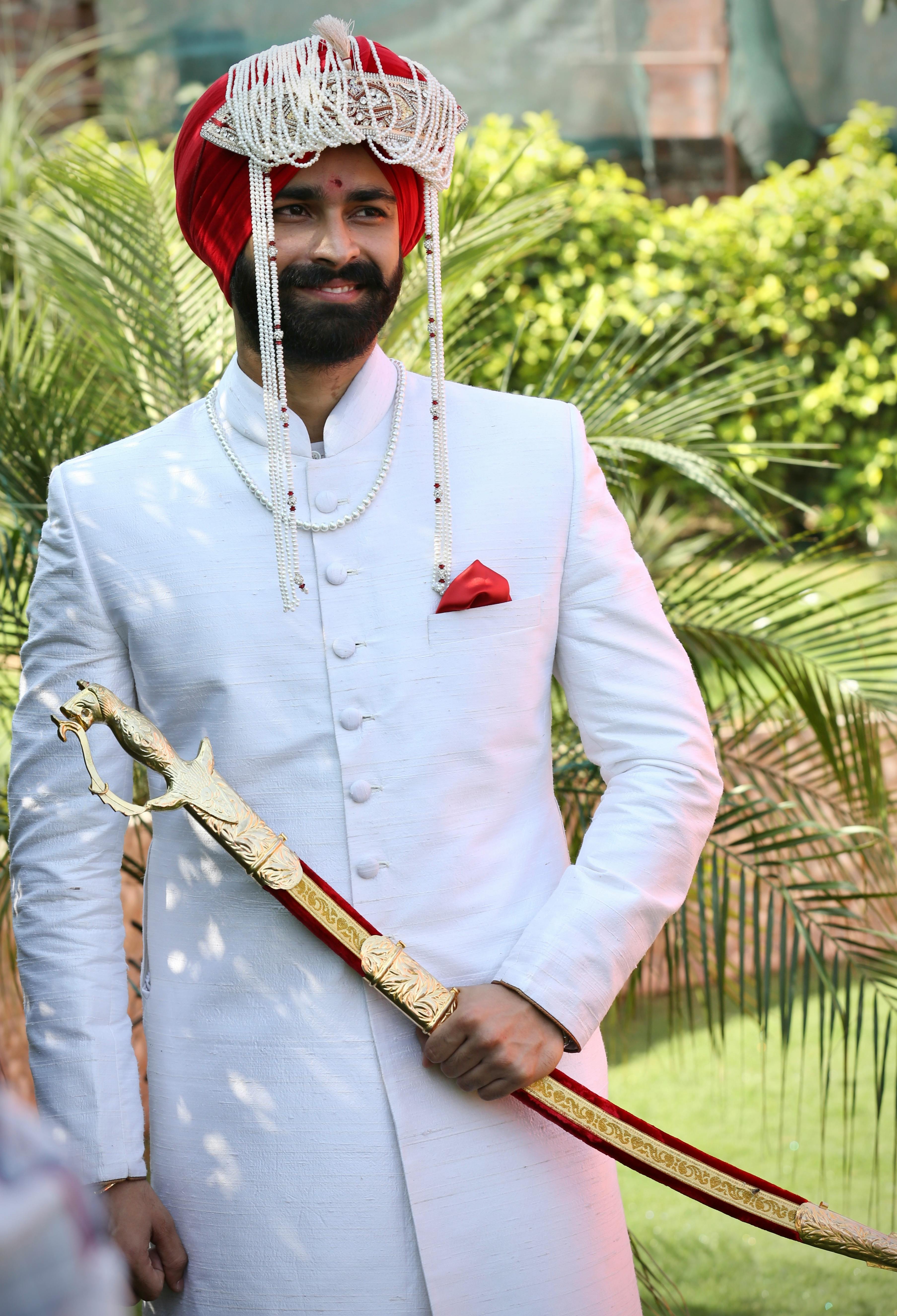 Traditional Indian Groom with Sword Outdoors · Free Stock Photo