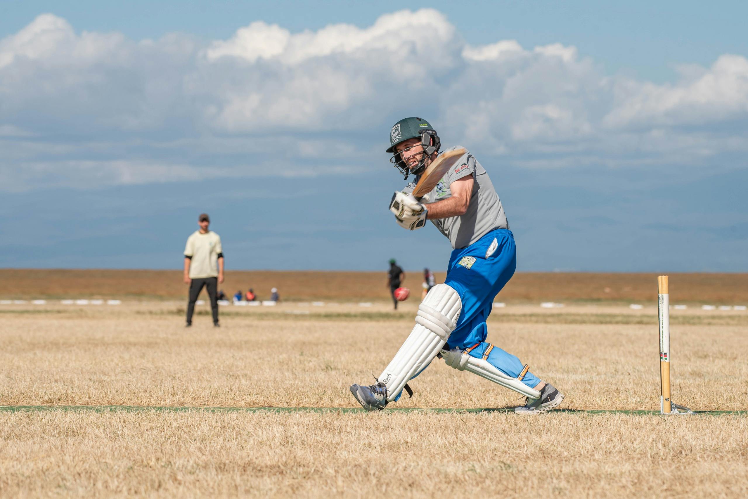 Cricketer batting on a sunny day outdoors · Free Stock Photo