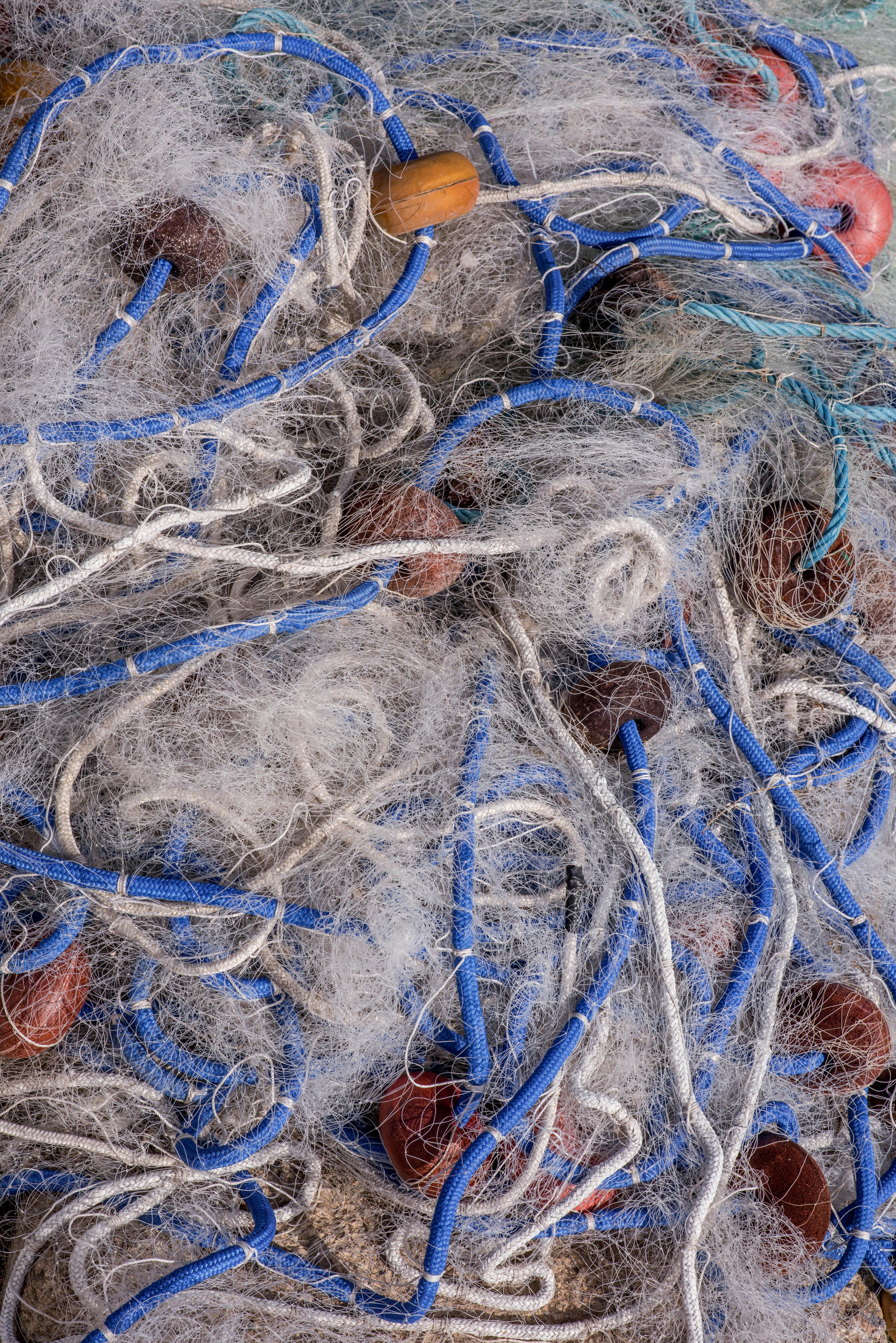 Close-up of Tangled Fishing Nets with Buoys · Free Stock Photo