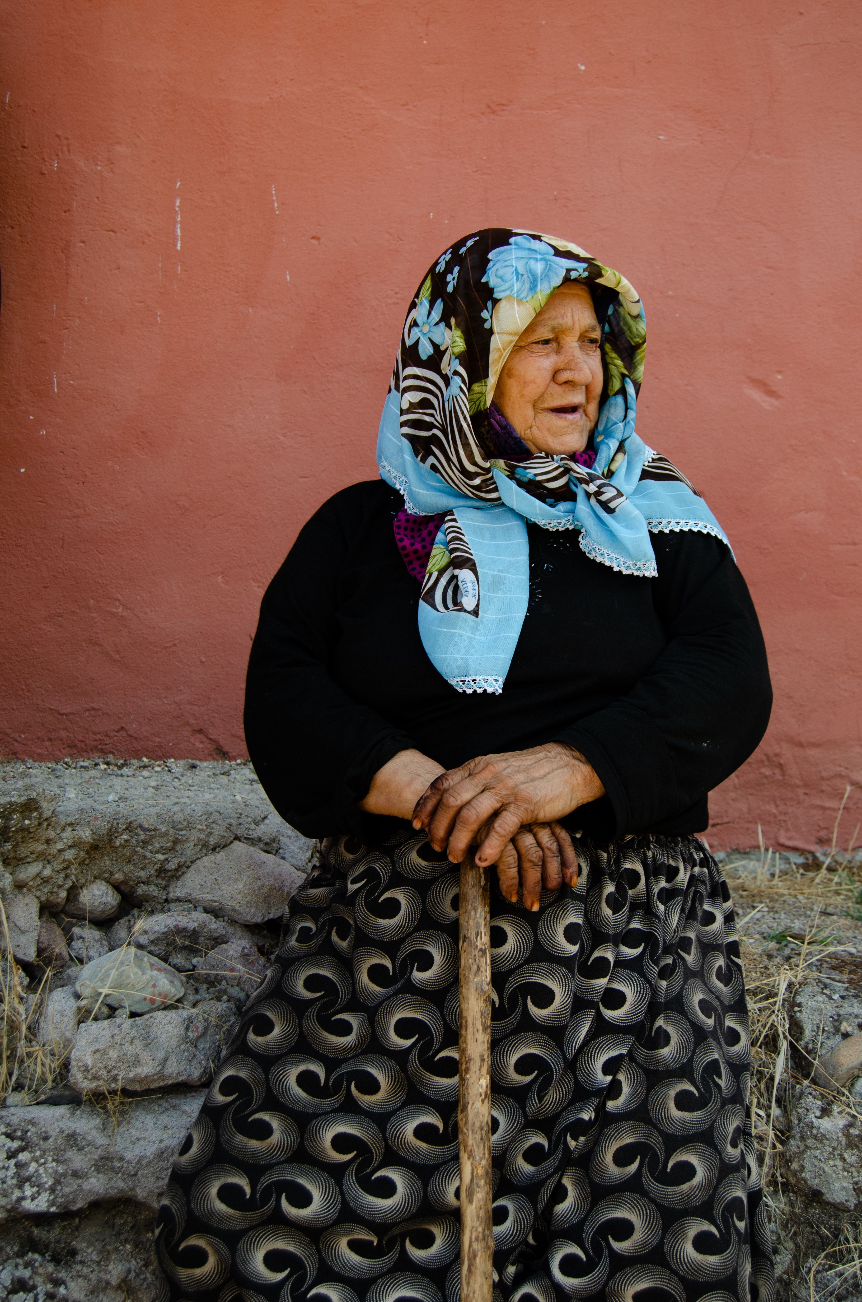 Elderly Woman in Traditional Attire with Headscarf · Free Stock Photo