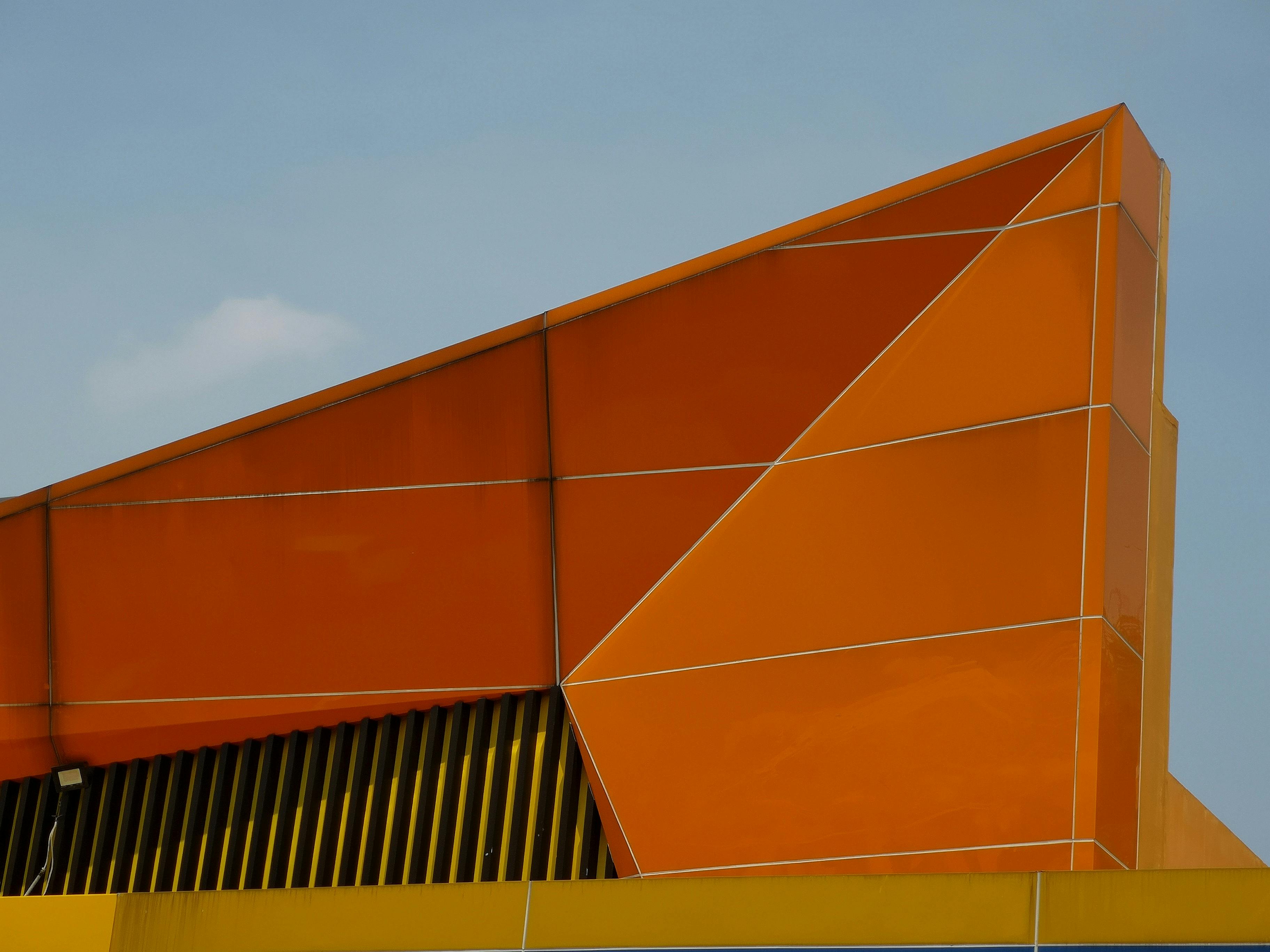 Modern Orange Building with Geometric Design · Free Stock Photo