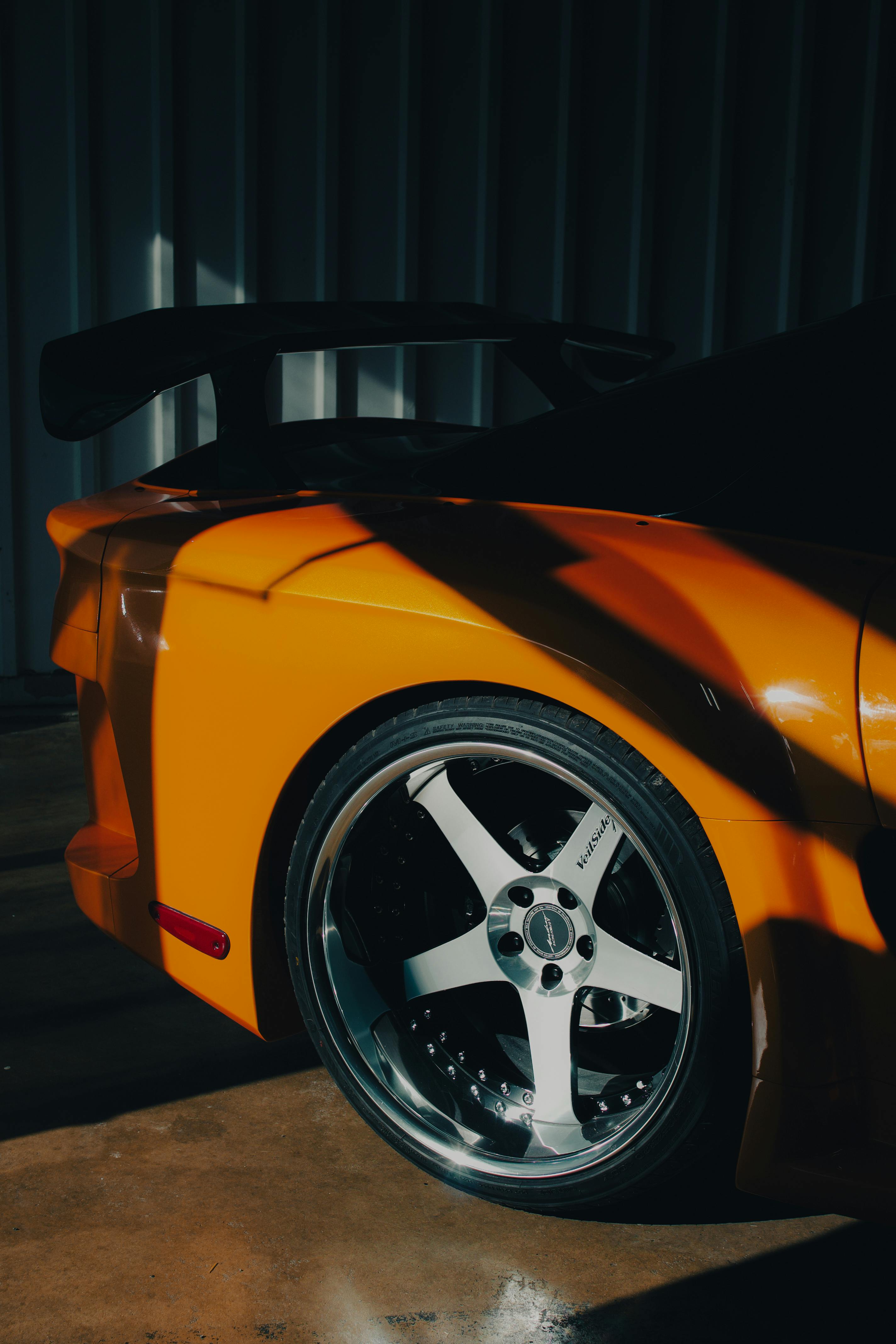 Close-up of a Modified Orange Mazda RX-7 · Free Stock Photo