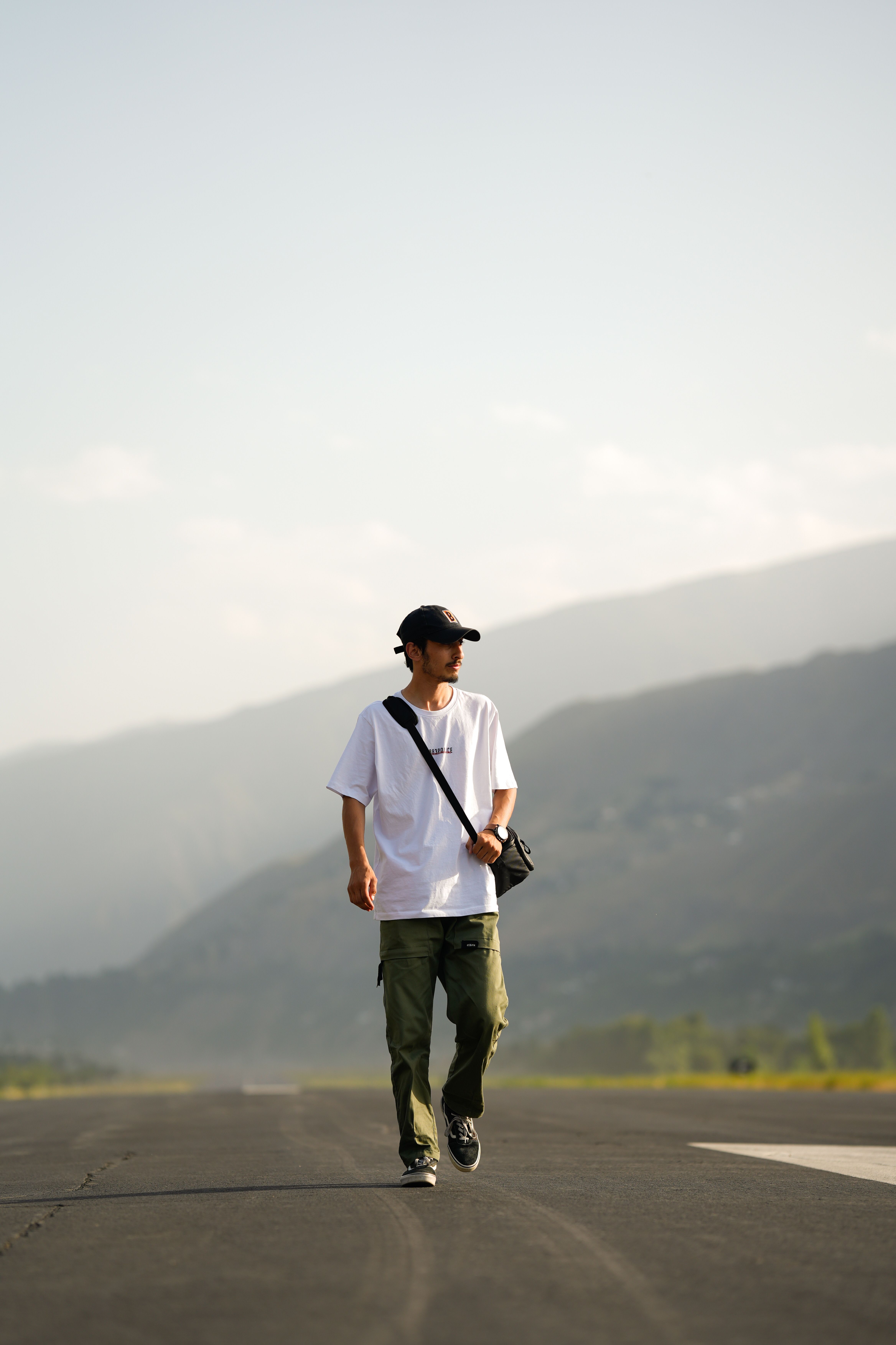 Man Walking in Scenic Chitral Landscape · Free Stock Photo