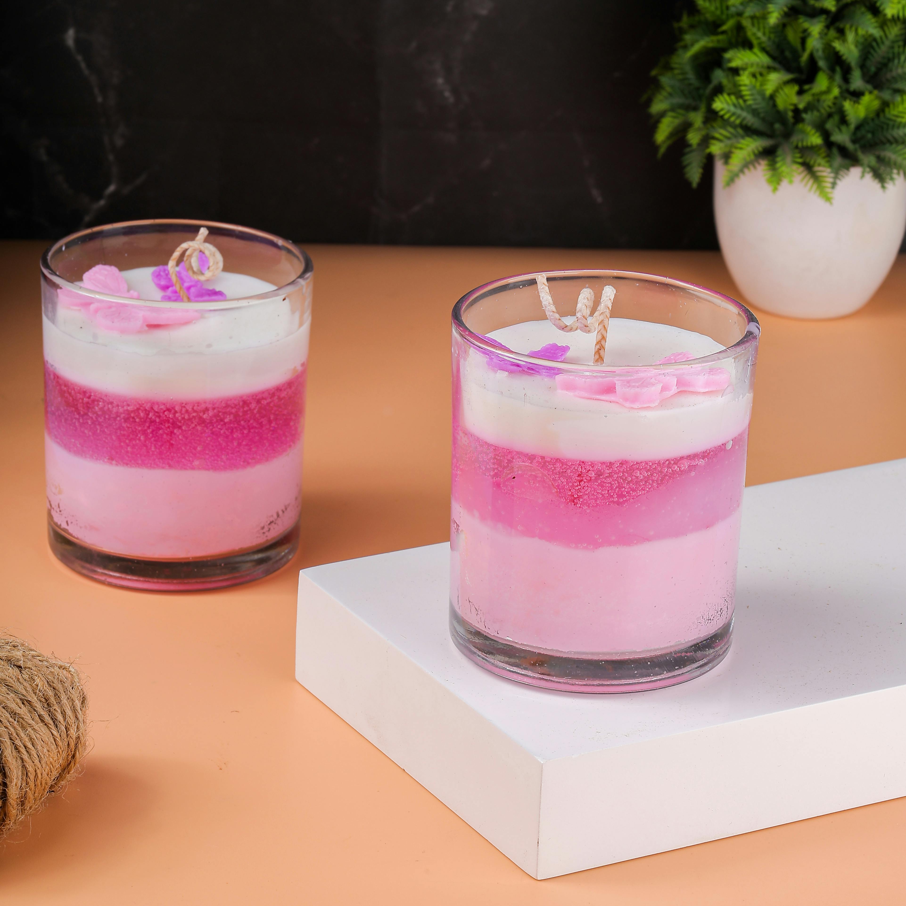 Vibrant Pink and White Layered Candles Decor · Free Stock Photo