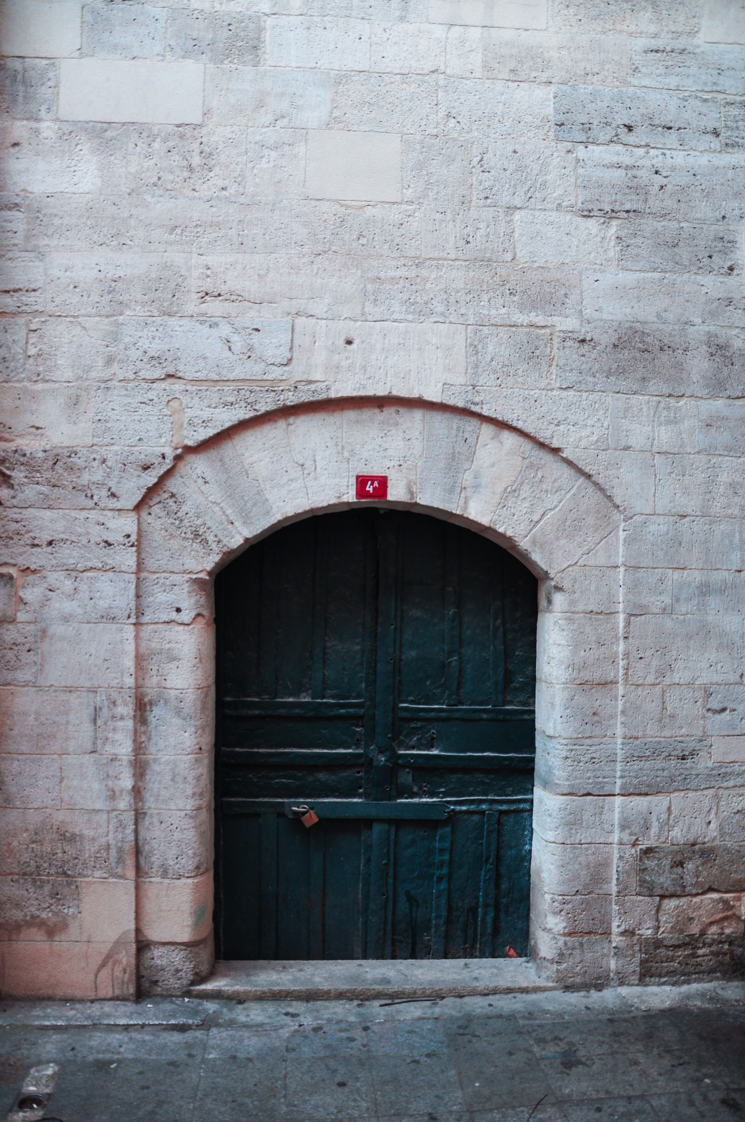 Rustic Arched Doorway of Stone Building · Free Stock Photo