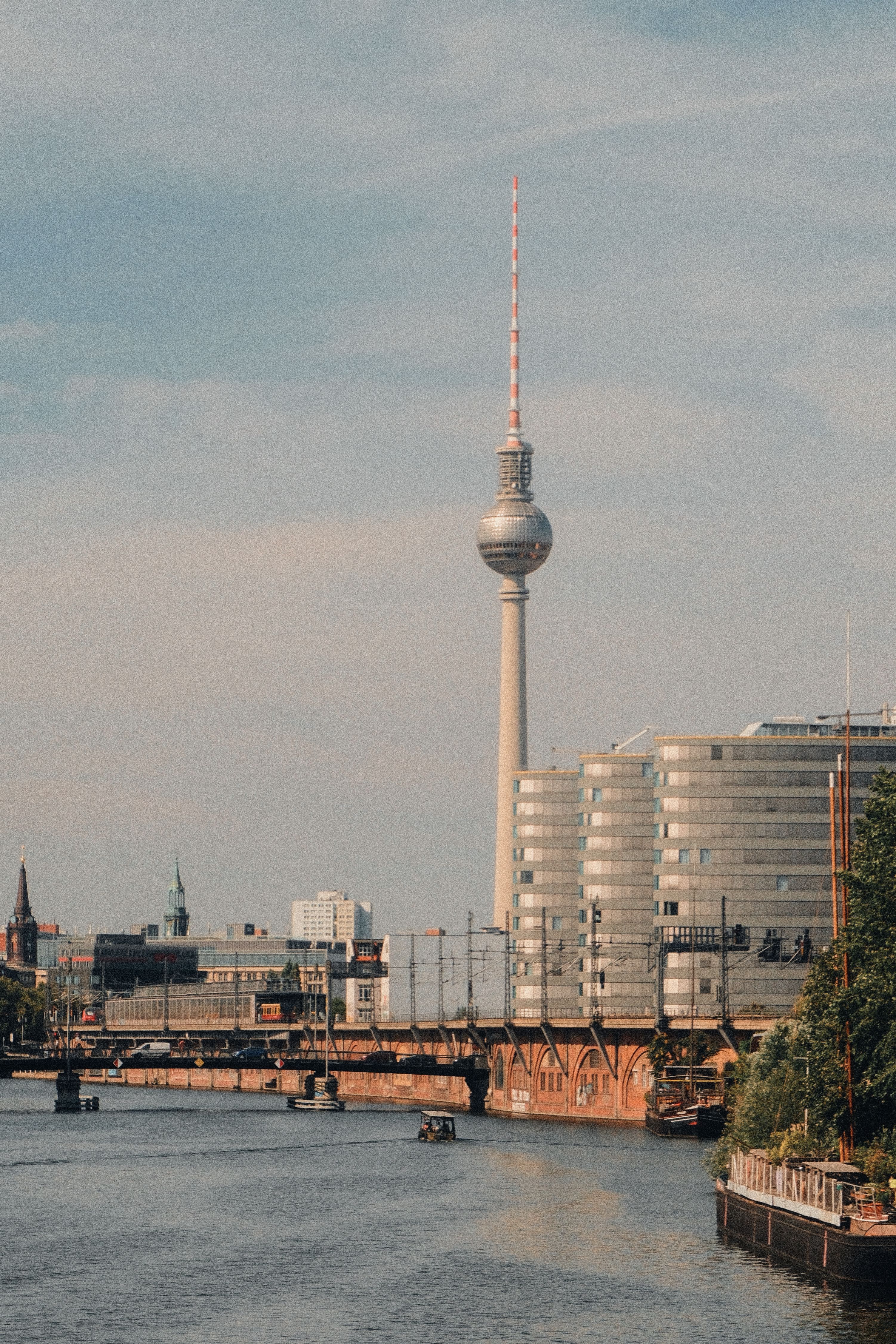 Iconic Berlin TV Tower Overlooking the Spree River · Free Stock Photo