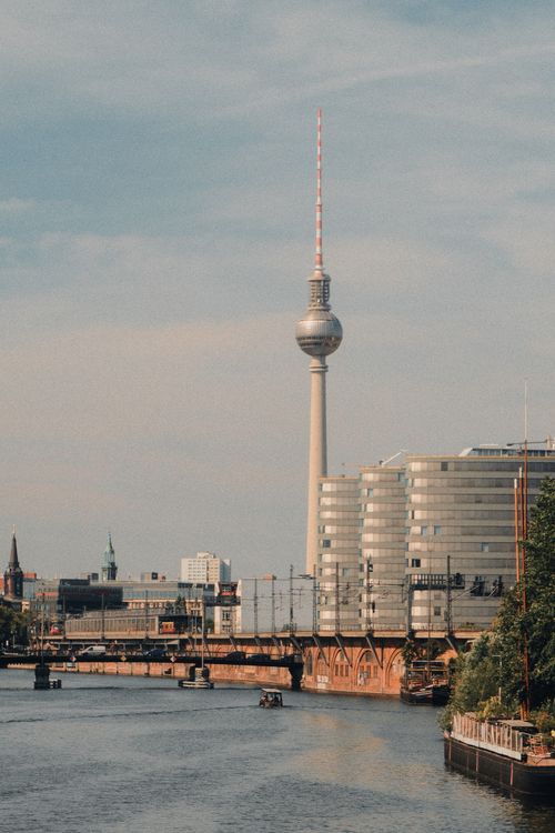 Iconic Berlin TV Tower Overlooking the Spree River · Free Stock Photo