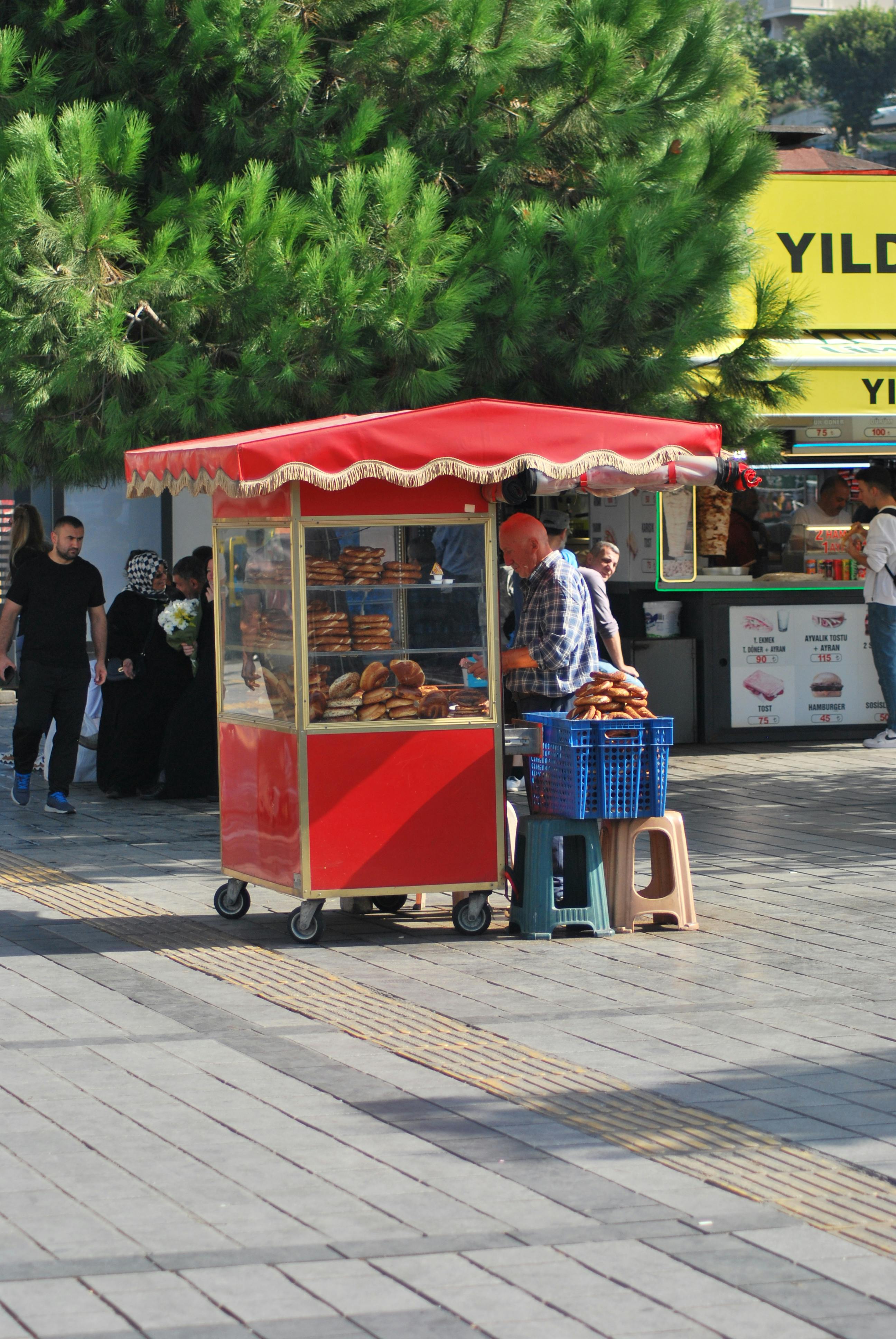 Street Vendor Selling Bread Outdoors · Free Stock Photo