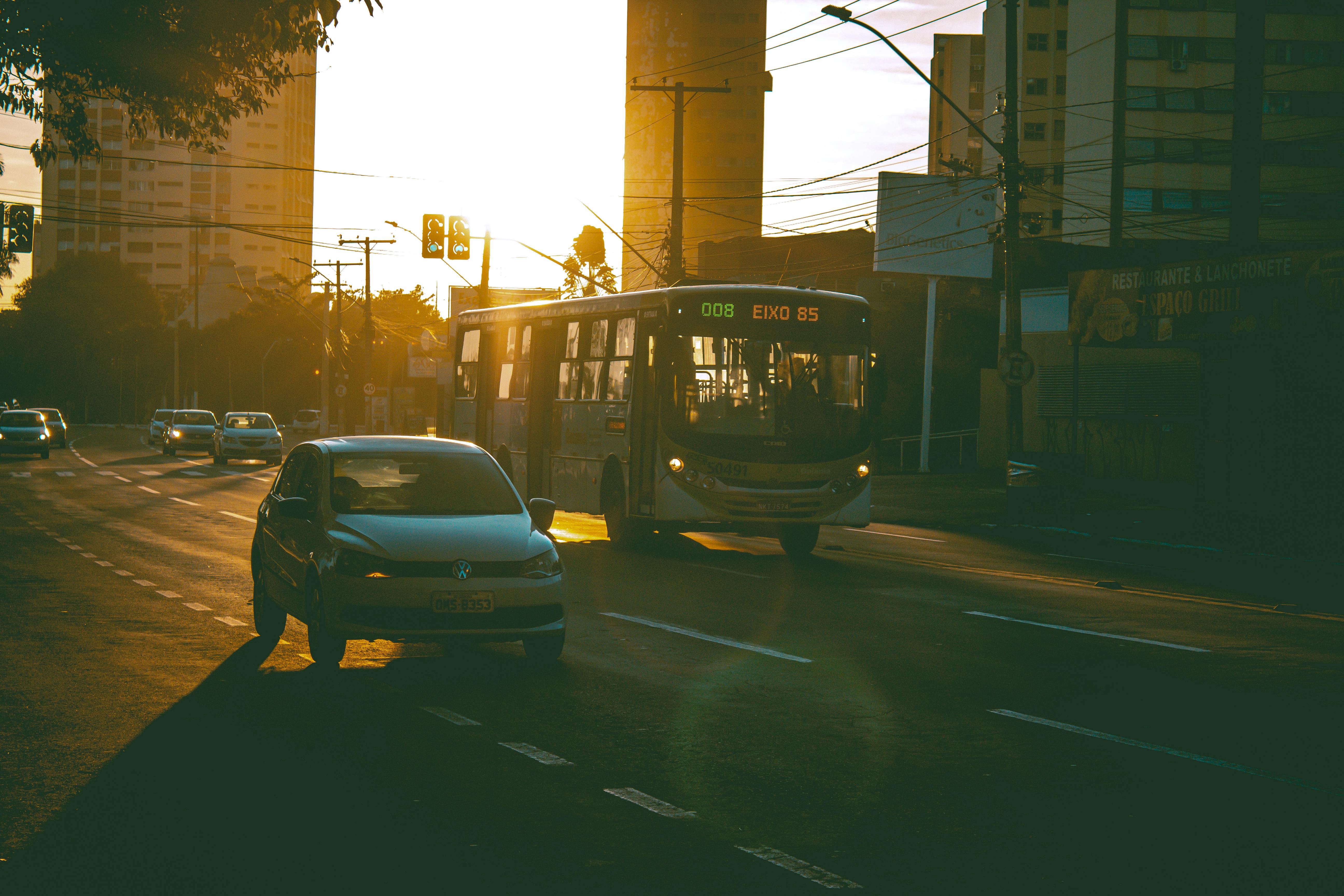 Public bus and cars at sunset in Goiânia street · Free Stock Photo