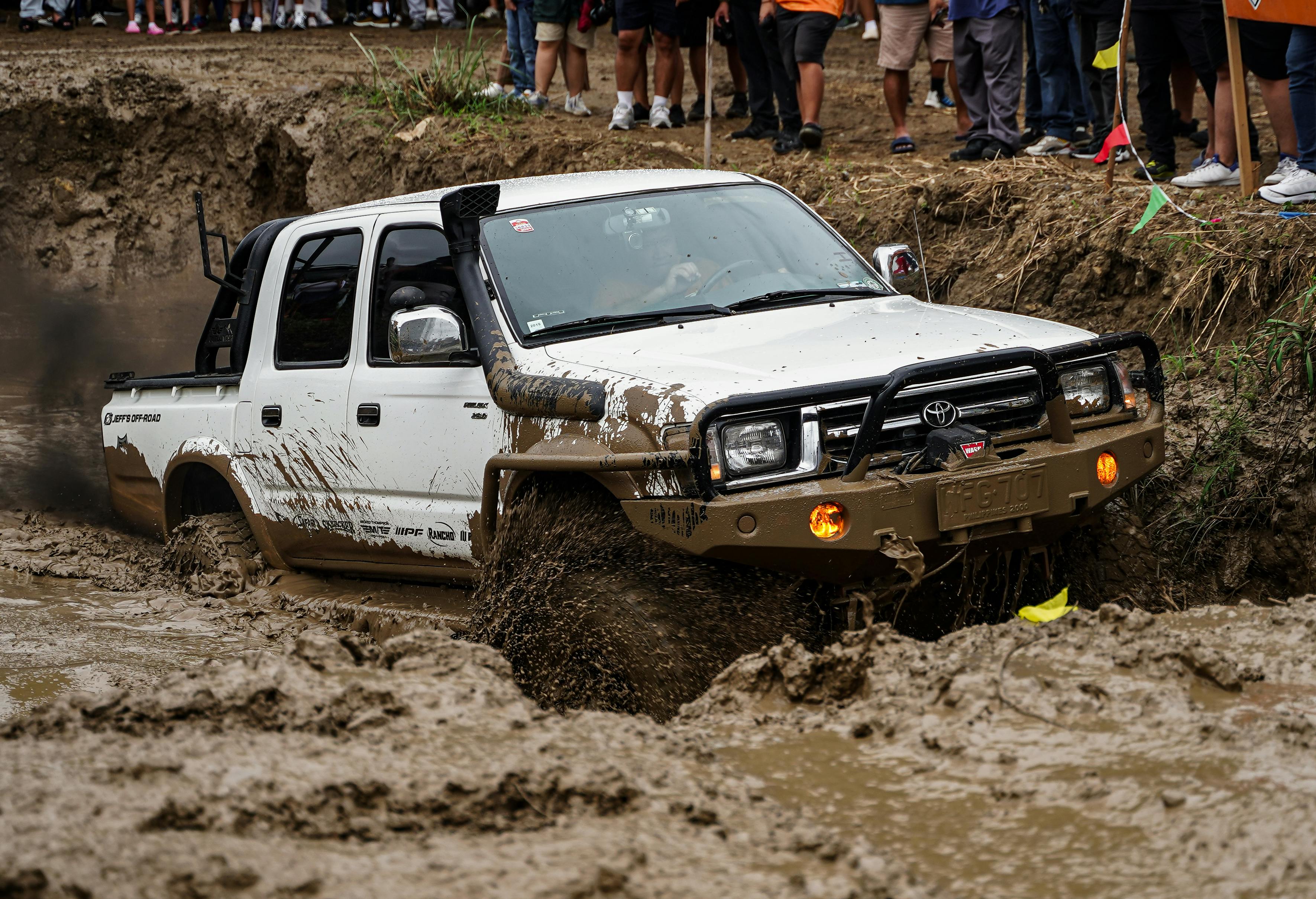 Off-Road 4x4 Truck Challenges Muddy Terrain · Free Stock Photo