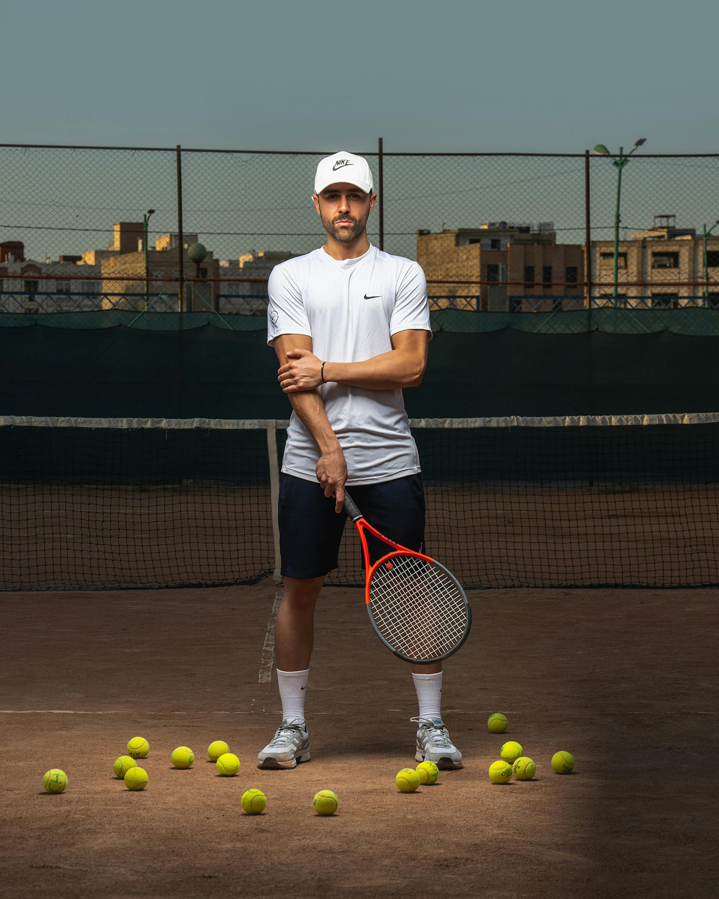 Professional Tennis Player on Clay Court Portrait · Free Stock Photo