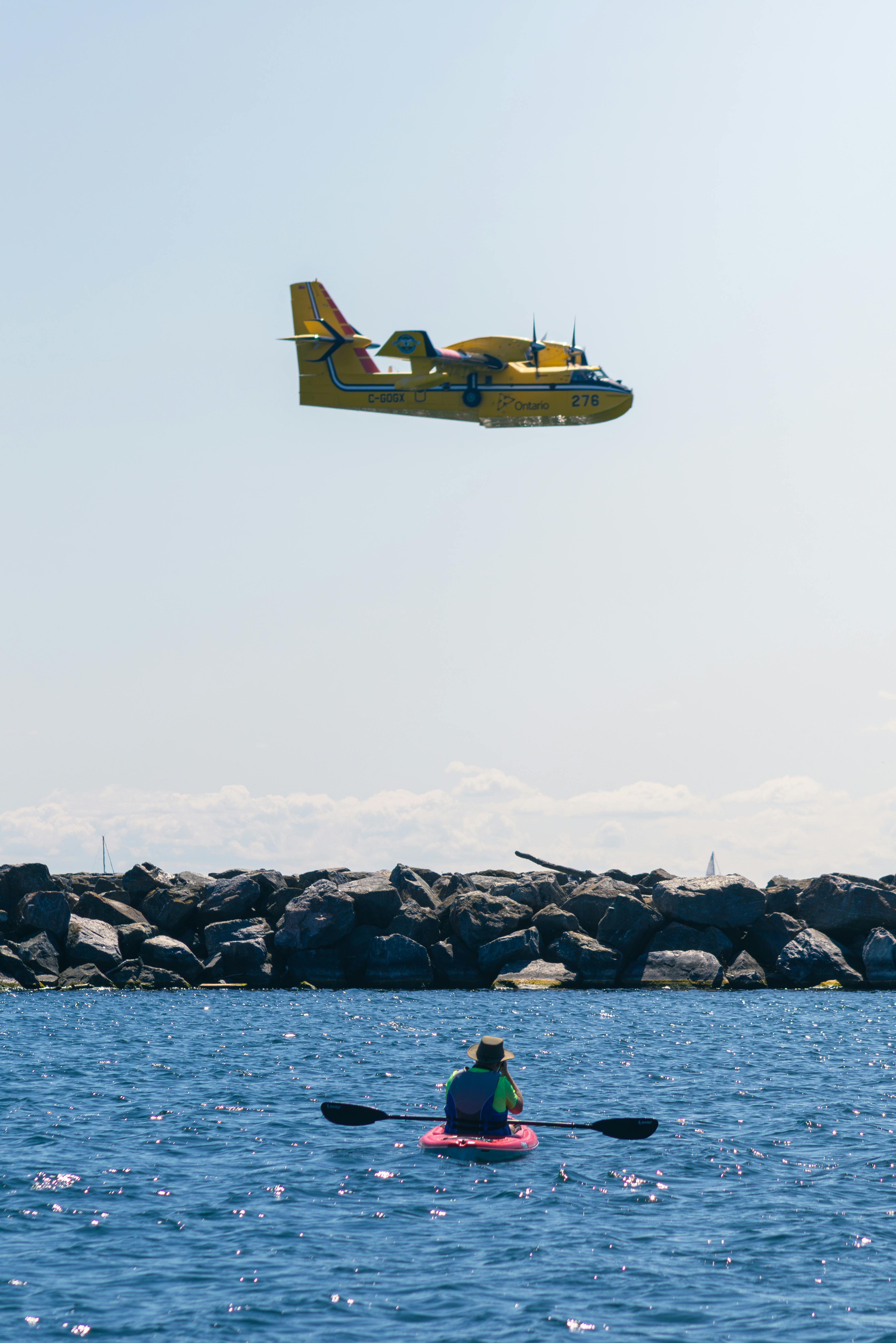 Kayak Adventure with Plane Overhead in Toronto · Free Stock Photo