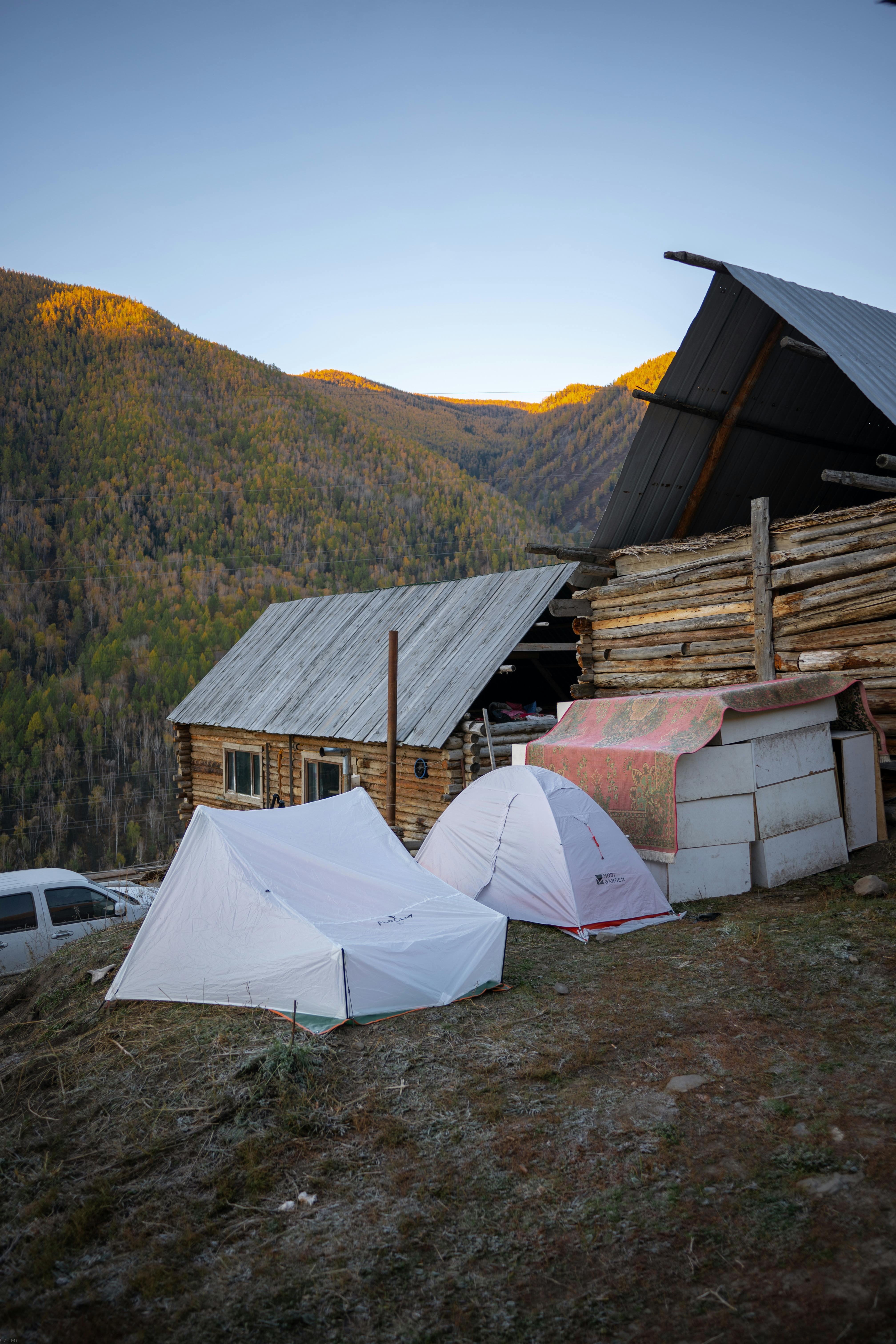 Rustic Mountain Campsite with Tents at Sunrise · Free Stock Photo