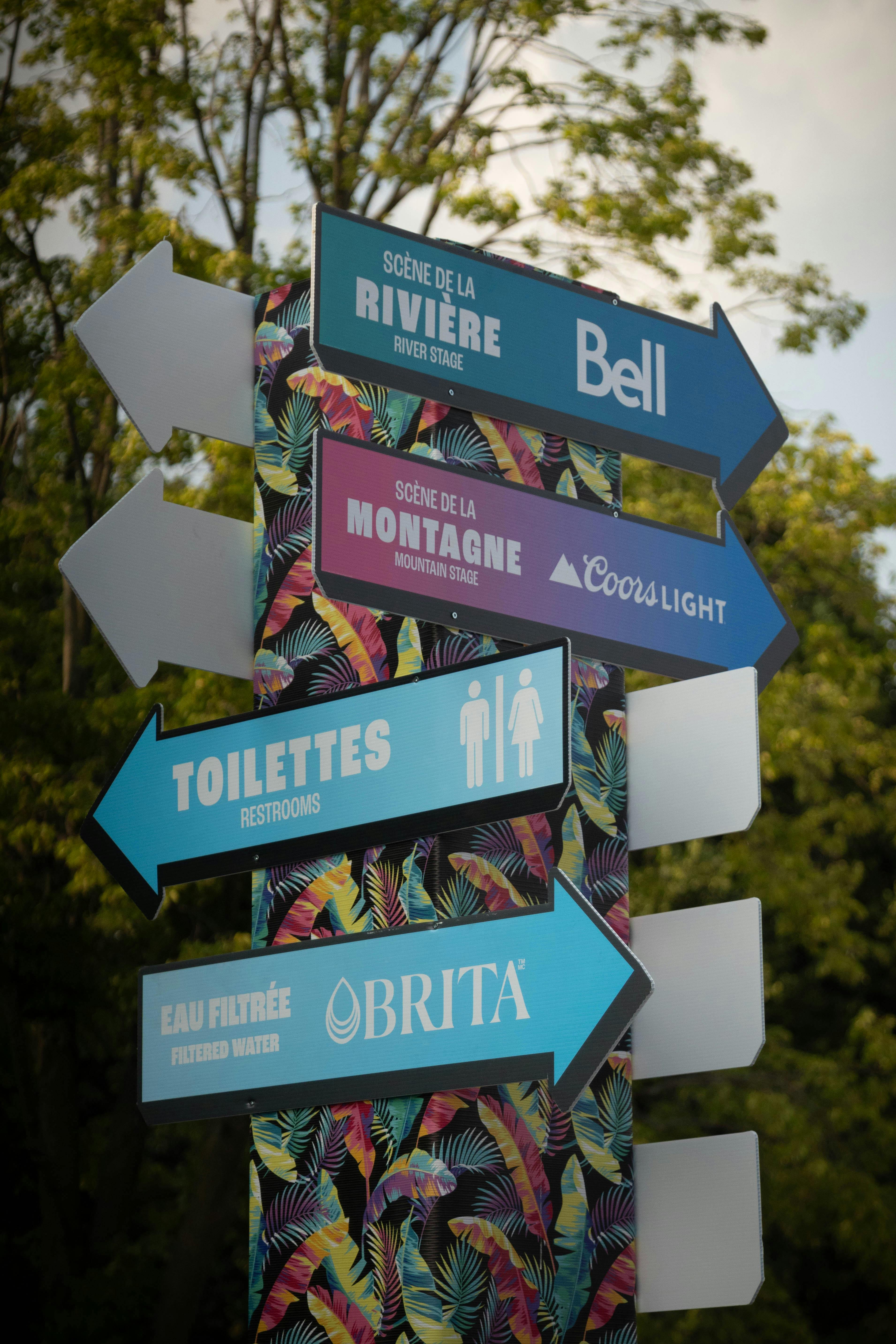 Directional Signs at Outdoor Festival in Montreal · Free Stock Photo