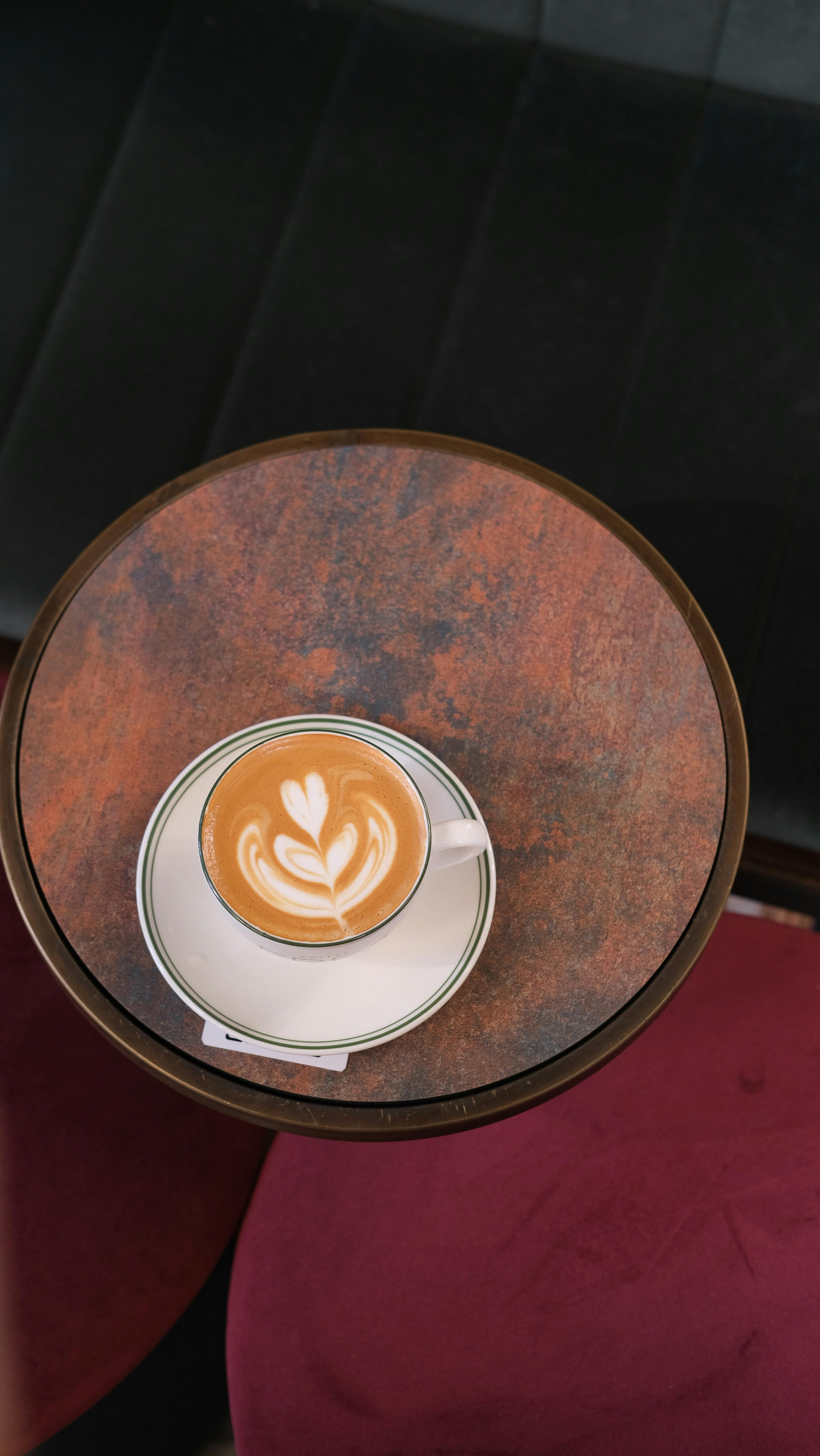Aerial View of Latte Art on Cafe Table · Free Stock Photo