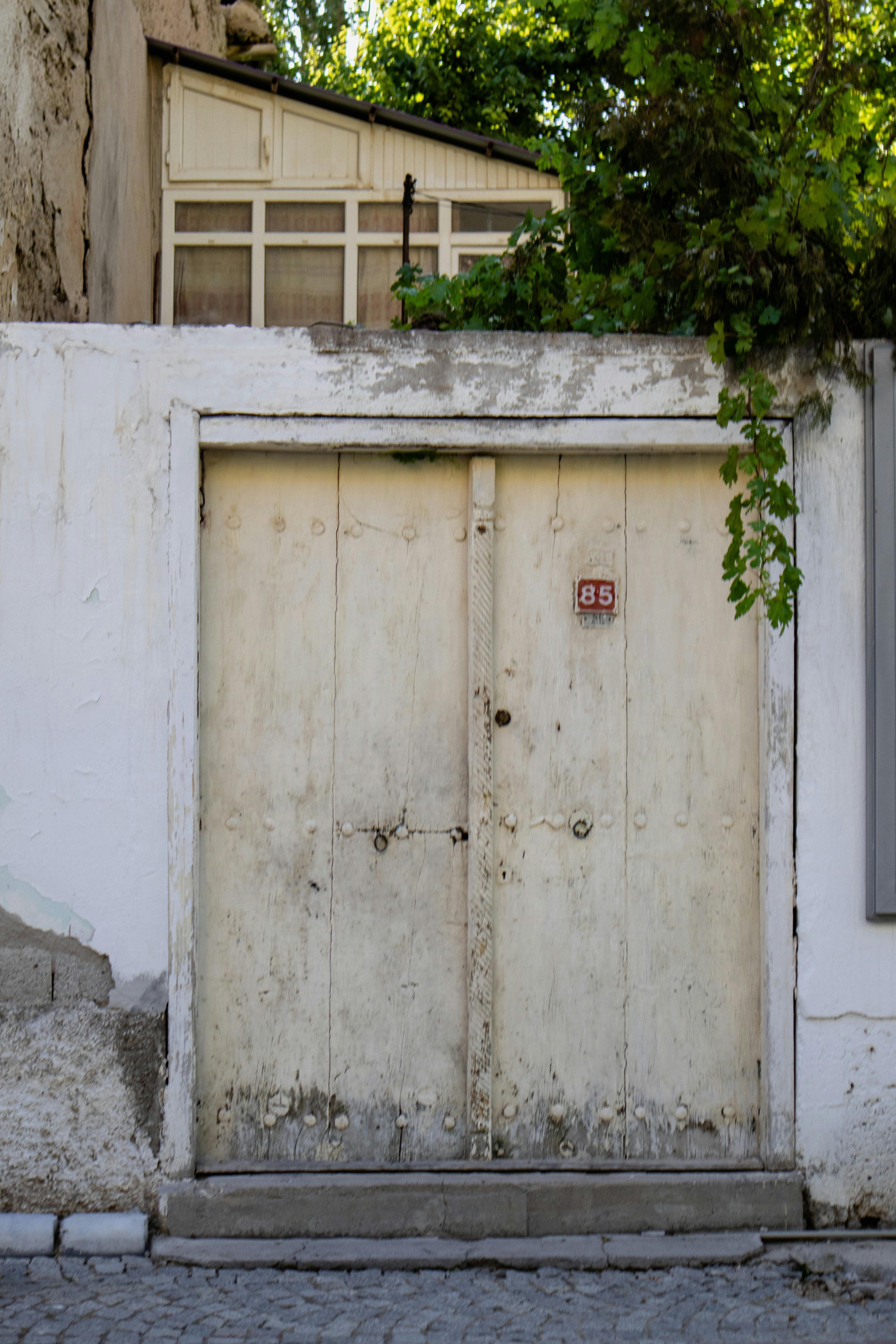 Rustic Wooden Gate on a Stone Wall in Darende · Free Stock Photo