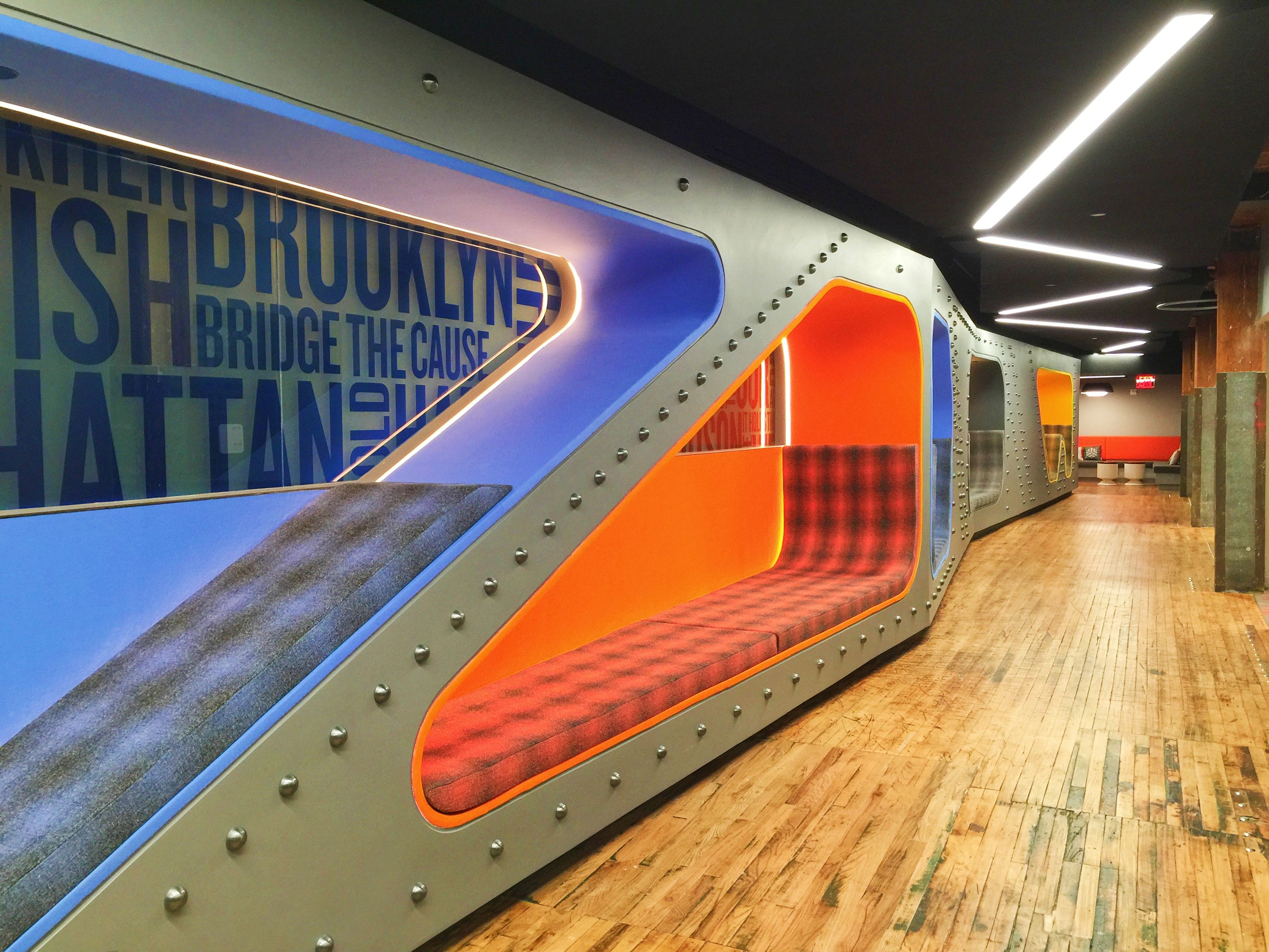 Modern Industrial Hallway with Vibrant Design · Free Stock Photo