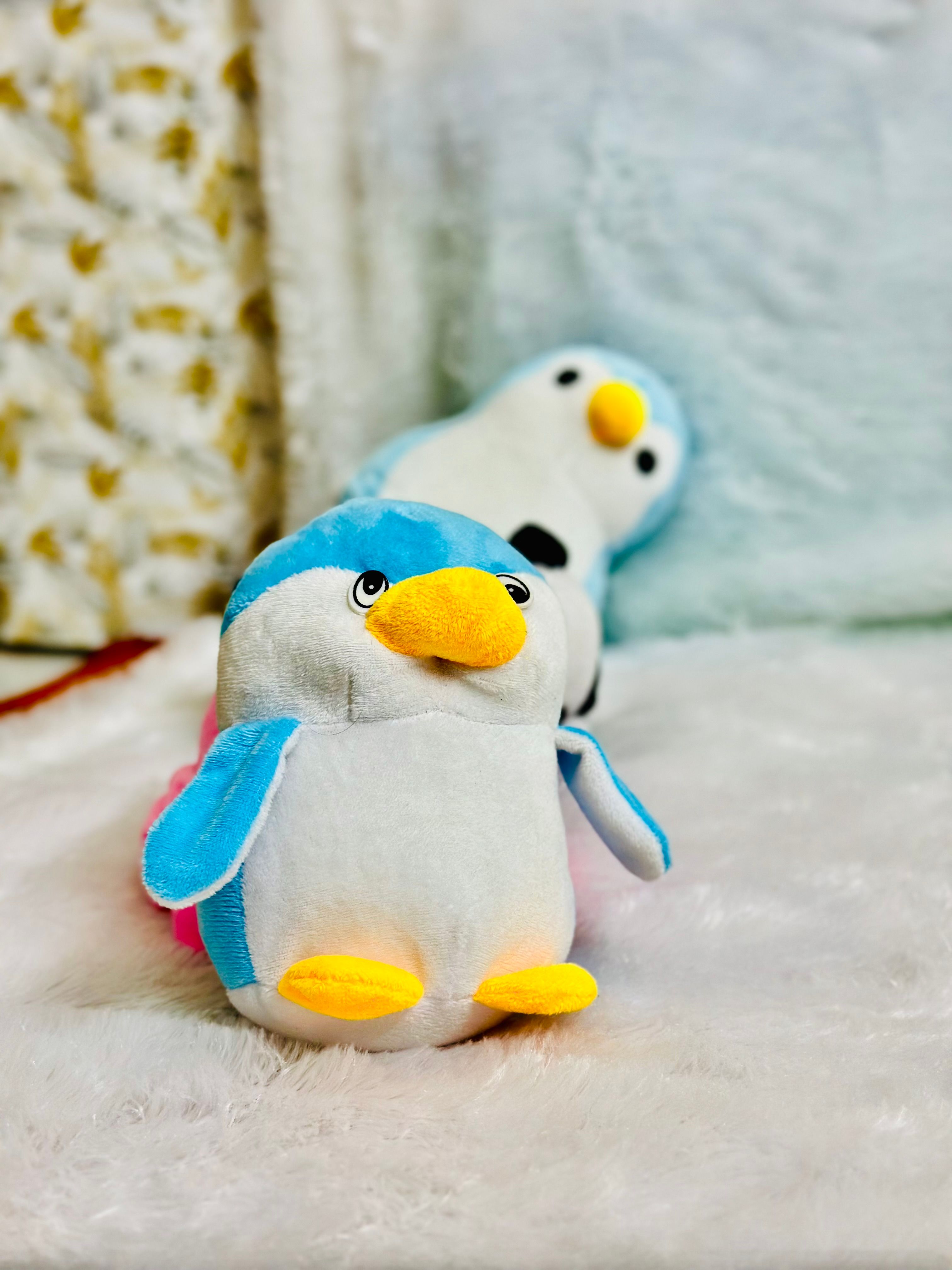 Colorful Penguin Plush Toys on Soft Surface · Free Stock Photo
