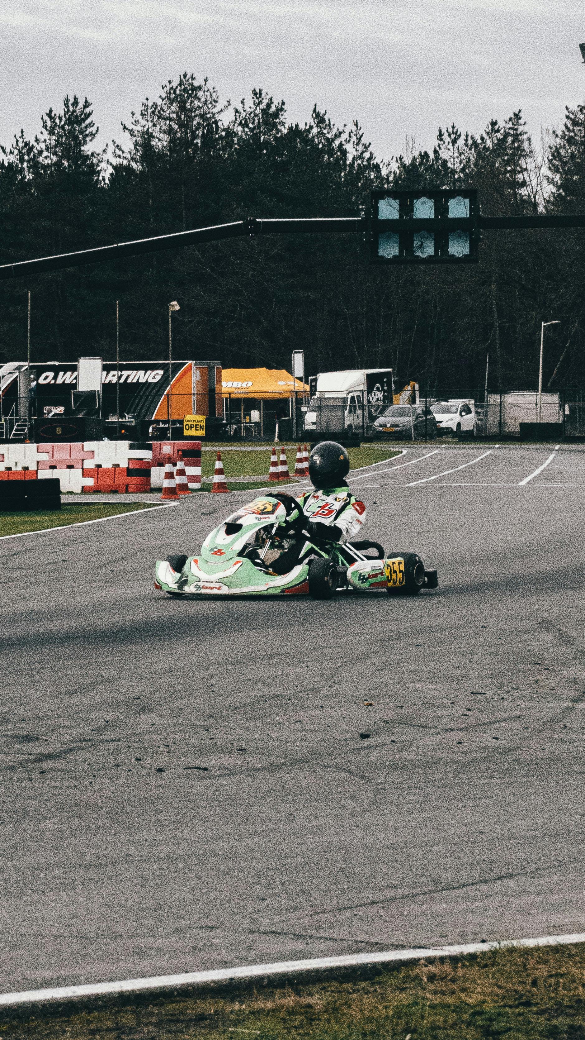 Adrenaline-Fueled Kart Racing on Circuit · Free Stock Photo
