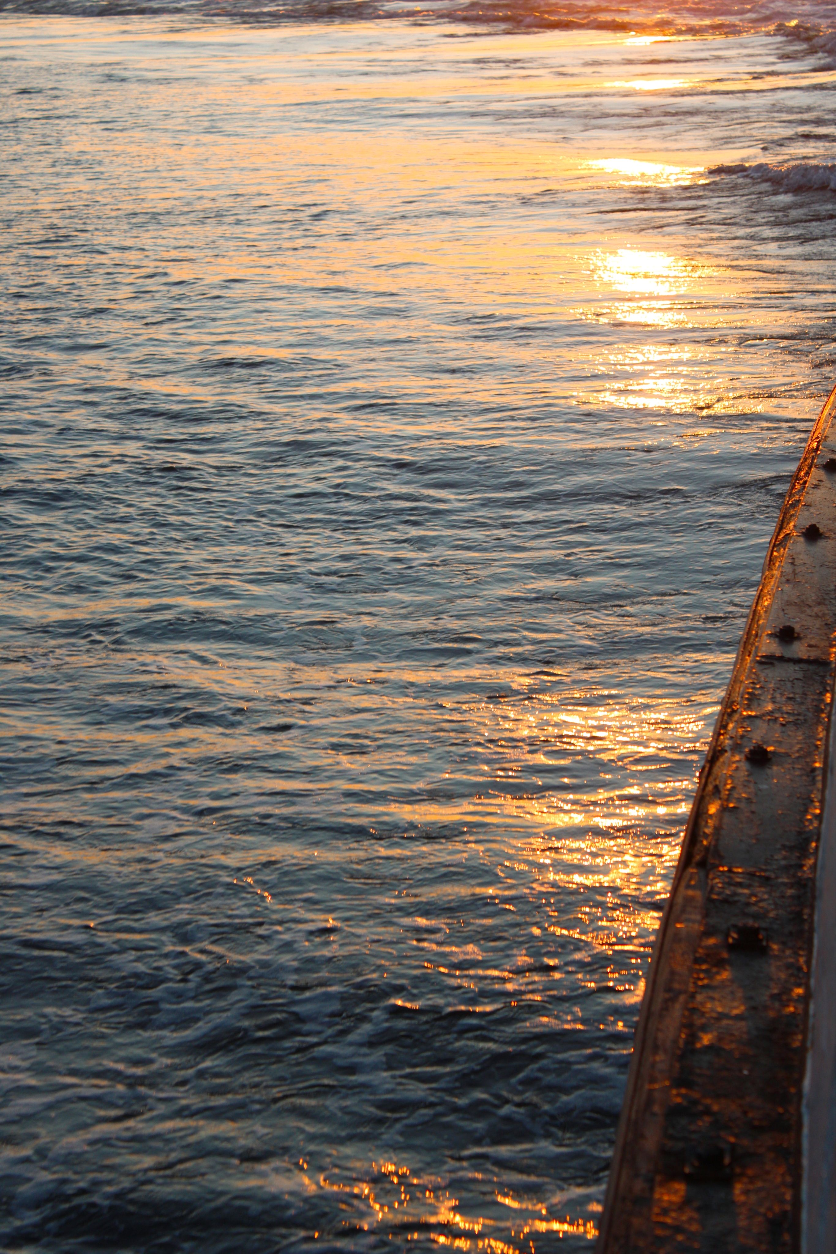 Golden Sunset Reflecting on Ocean Waves · Free Stock Photo
