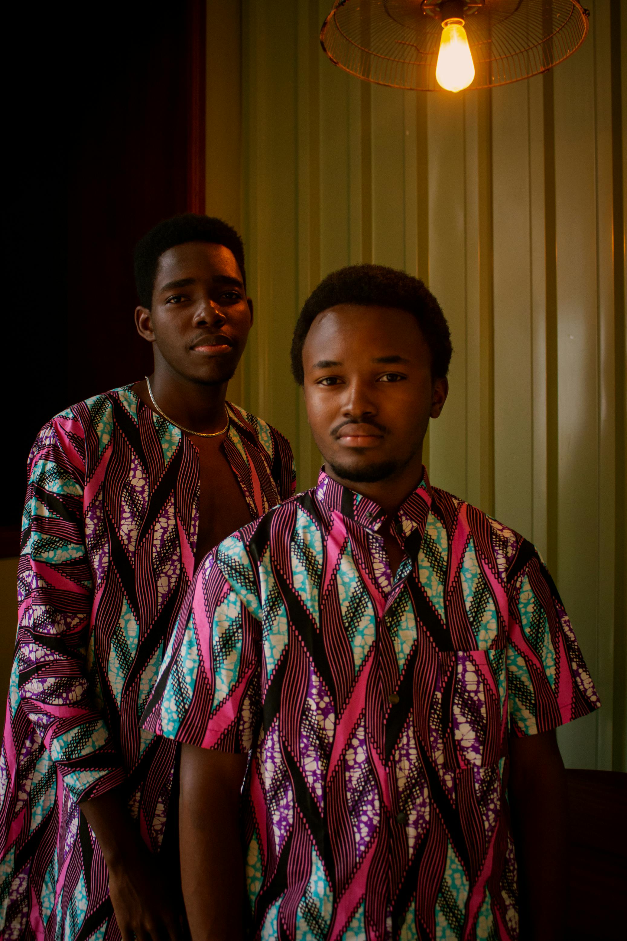 Stylish Portrait of Two Men in Patterned Outfits · Free Stock Photo