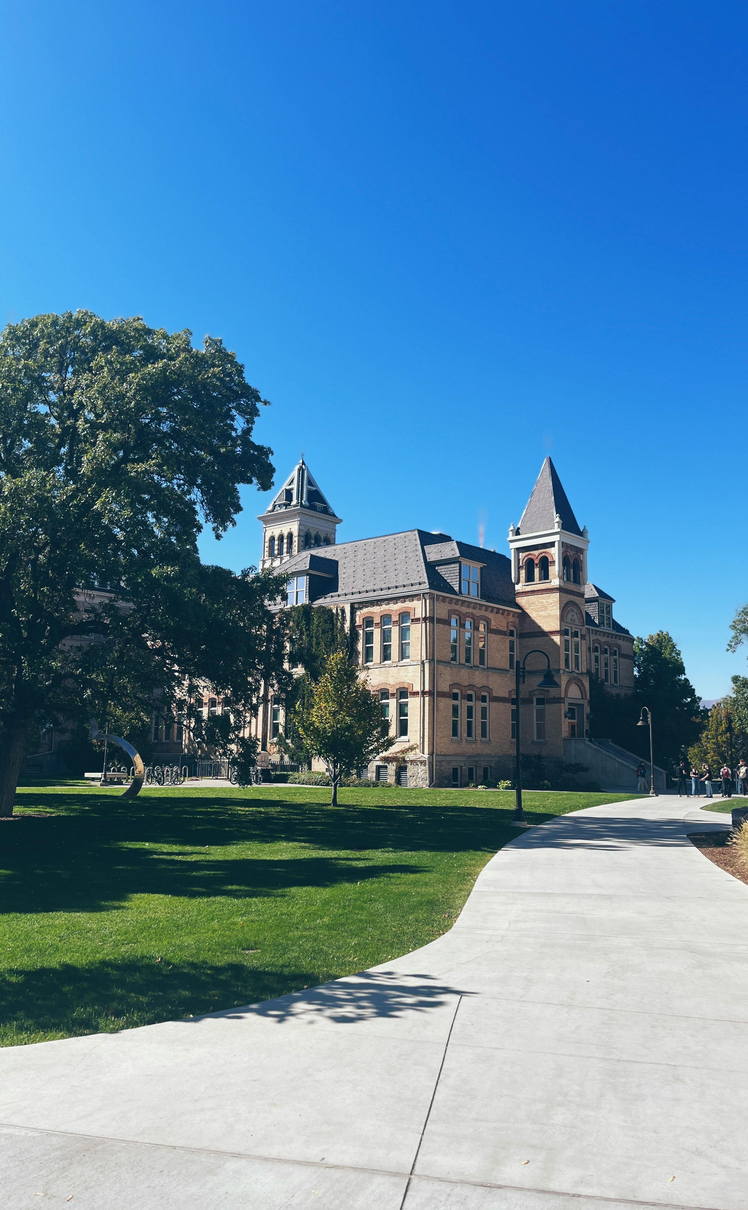 Historic University Building with Twin Towers · Free Stock Photo