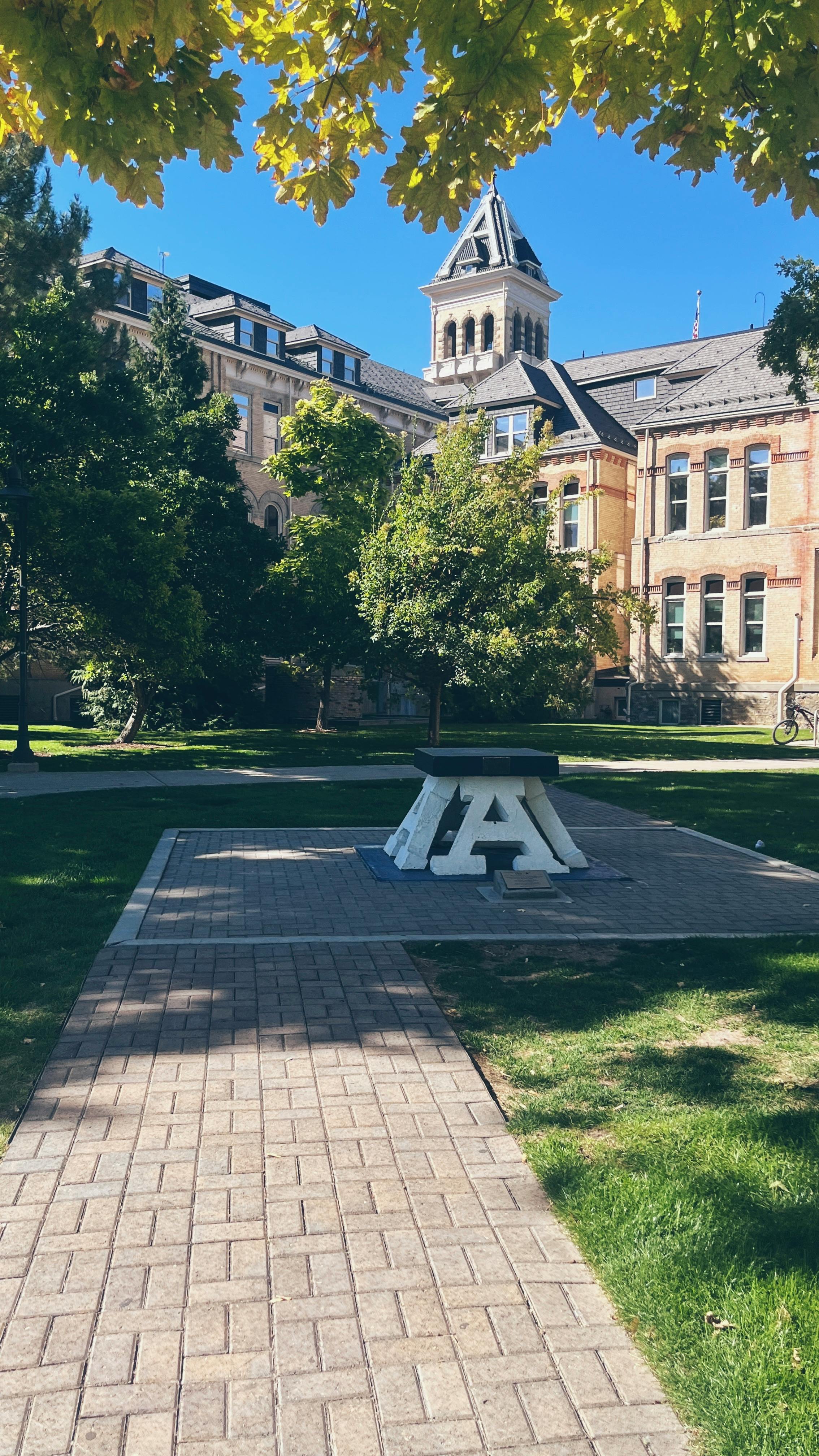 Historic Academic Building and Scenic Campus Pathway · Free Stock Photo